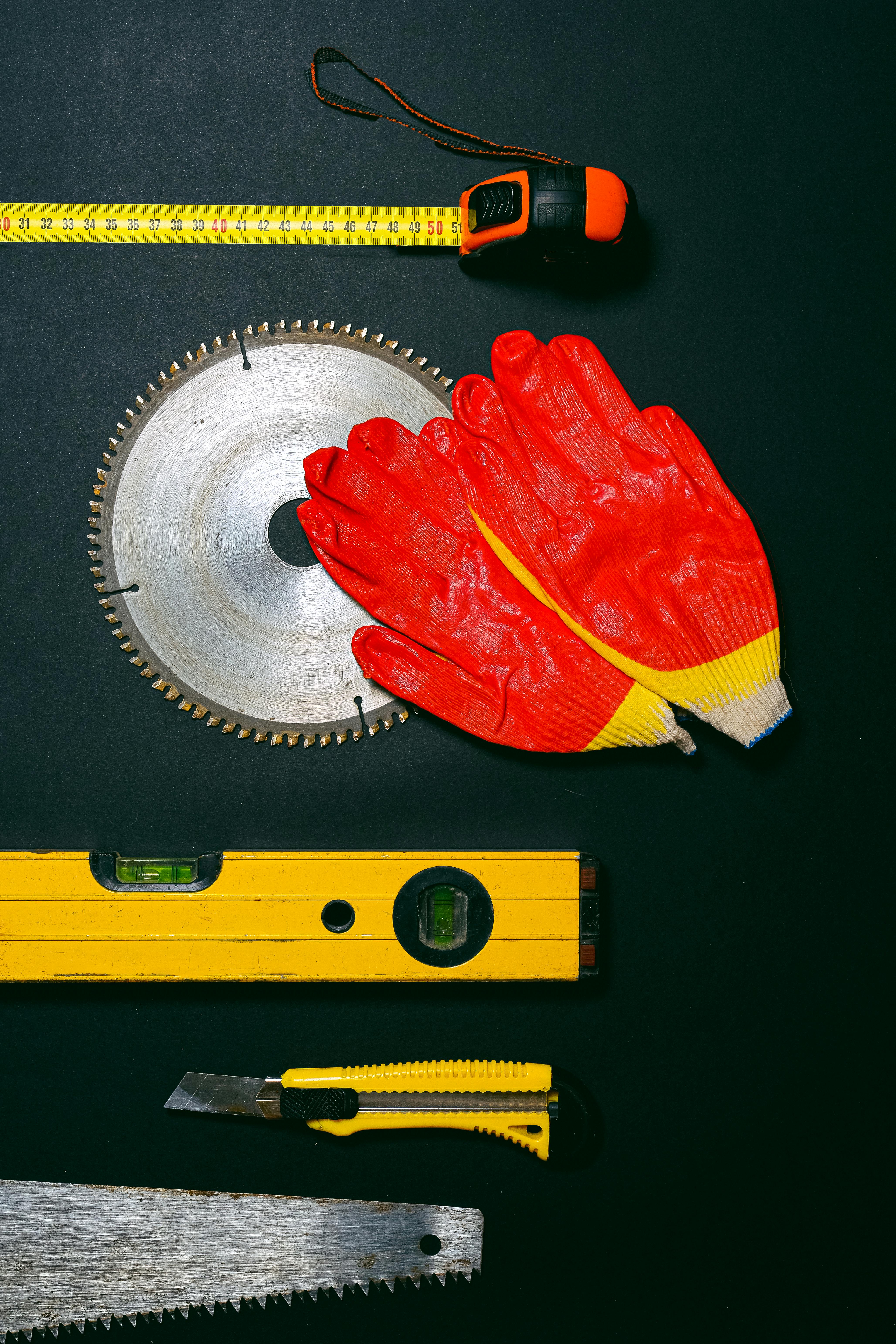 Red and Yellow Hand Tools on the Table · Free Stock Photo