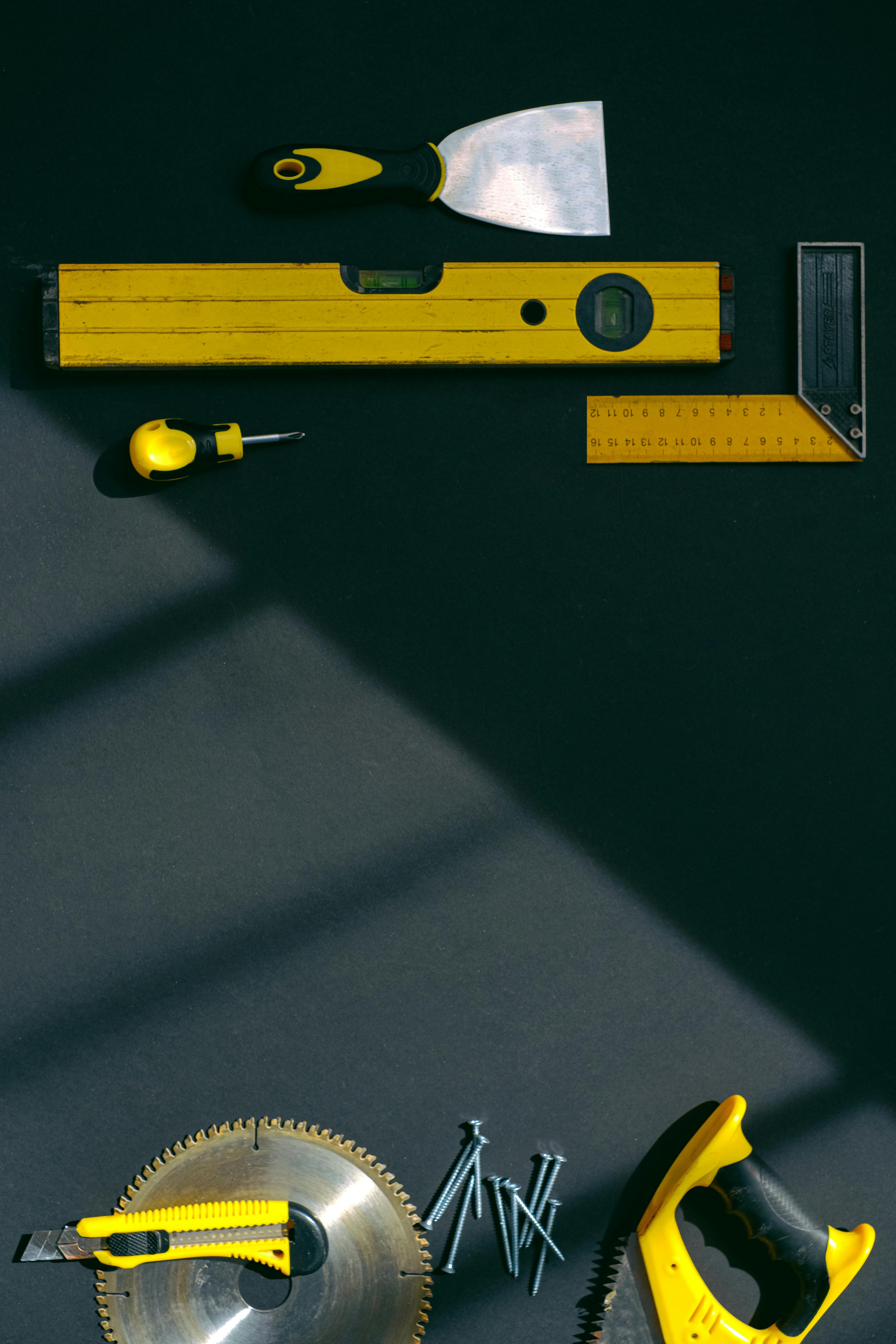 Yellow and Black Hand Tools on the Table · Free Stock Photo