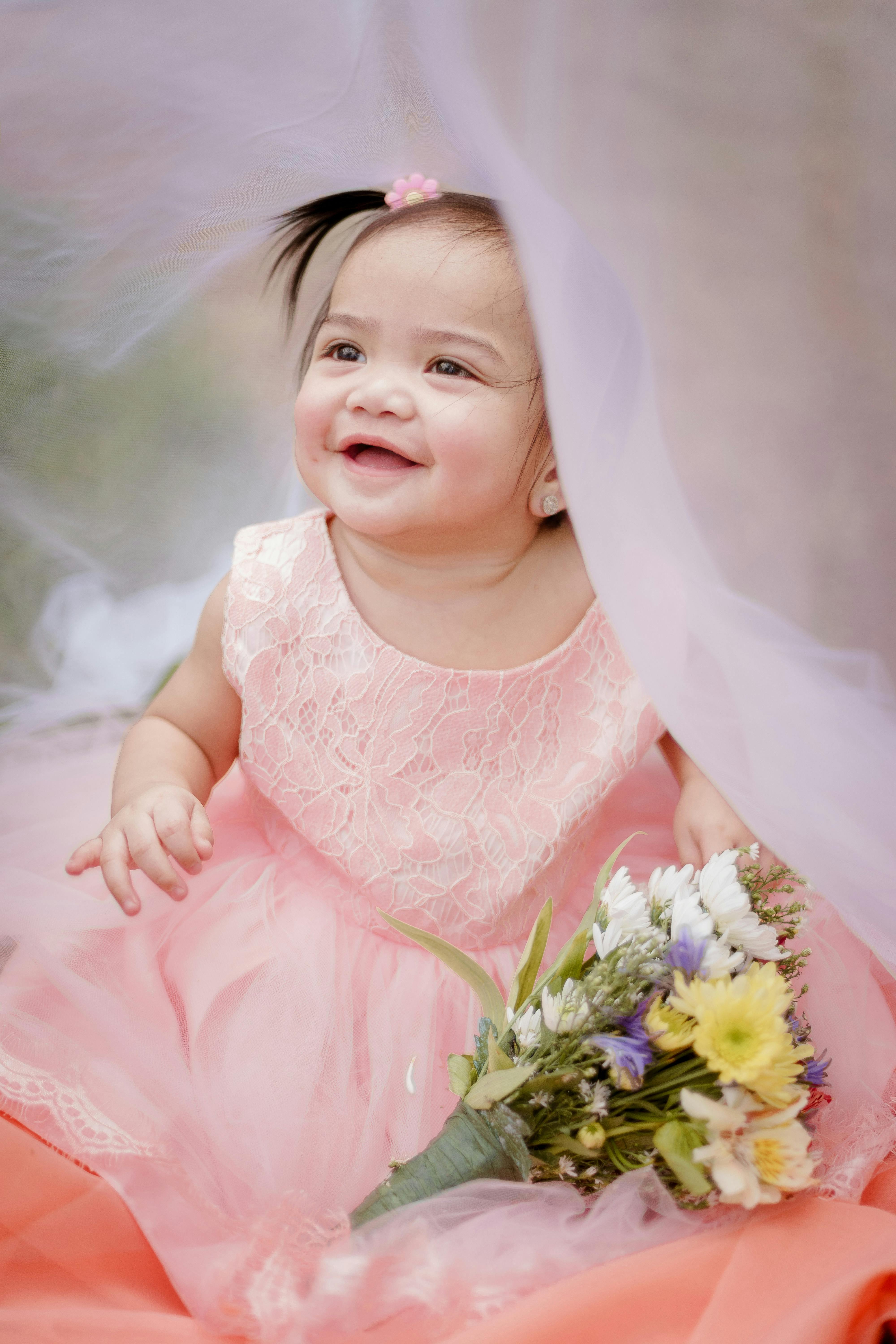 Photo of a Smiling Baby in a Pink Outfit · Free Stock Photo