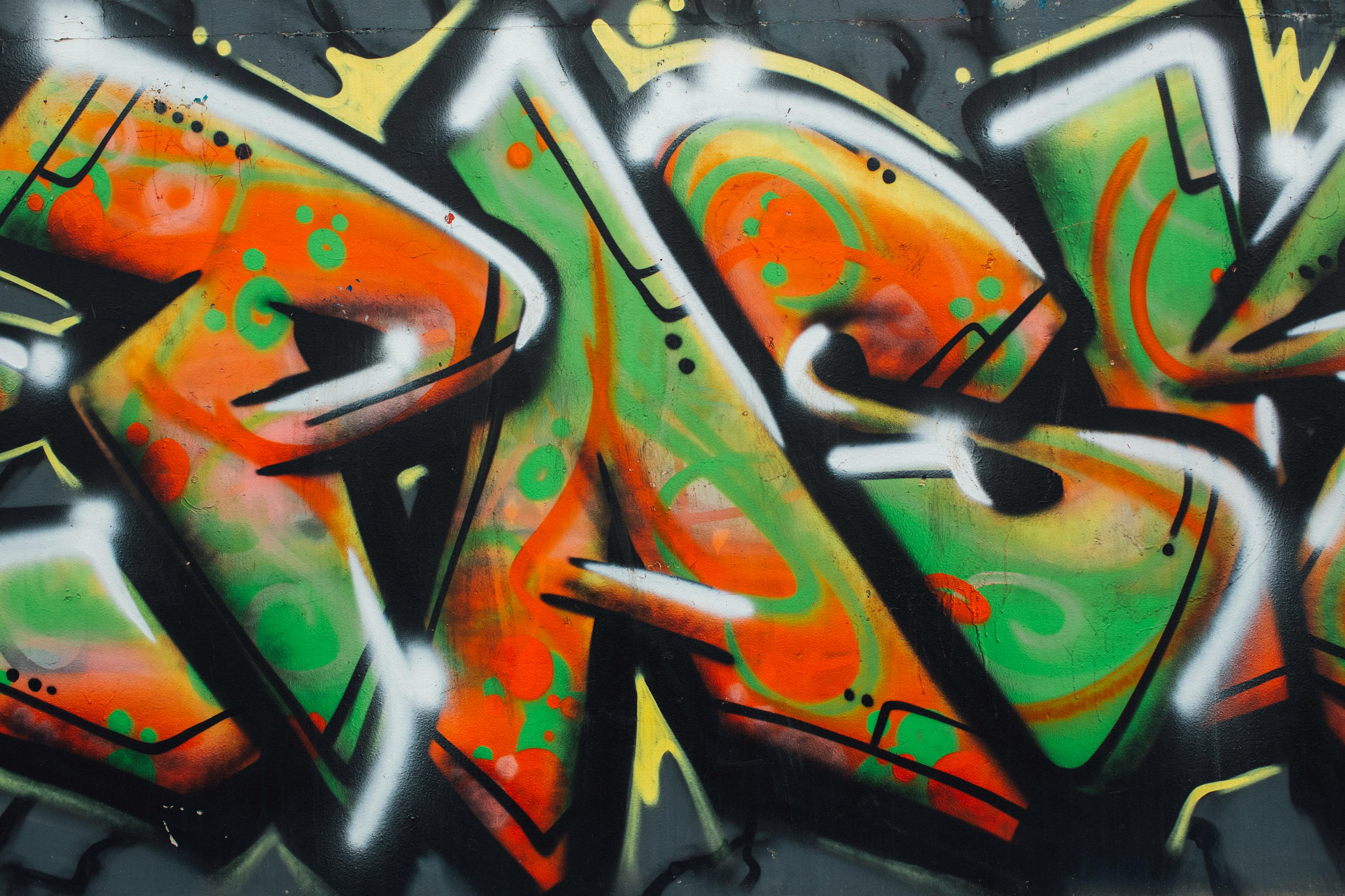 Orange Green and Black Graffiti on the Wall · Free Stock Photo