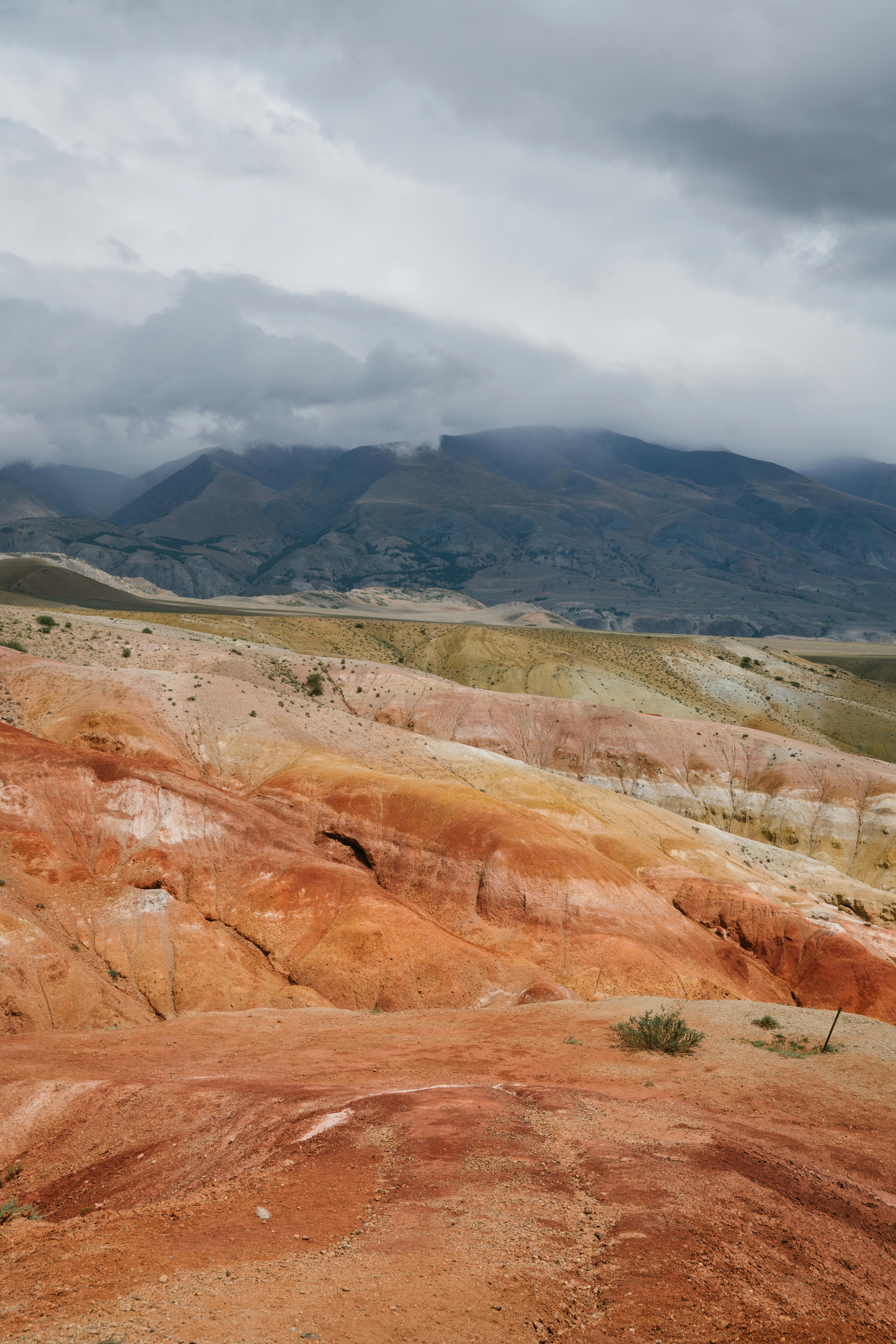 Dry semidesert valley against green mountains · Free Stock Photo