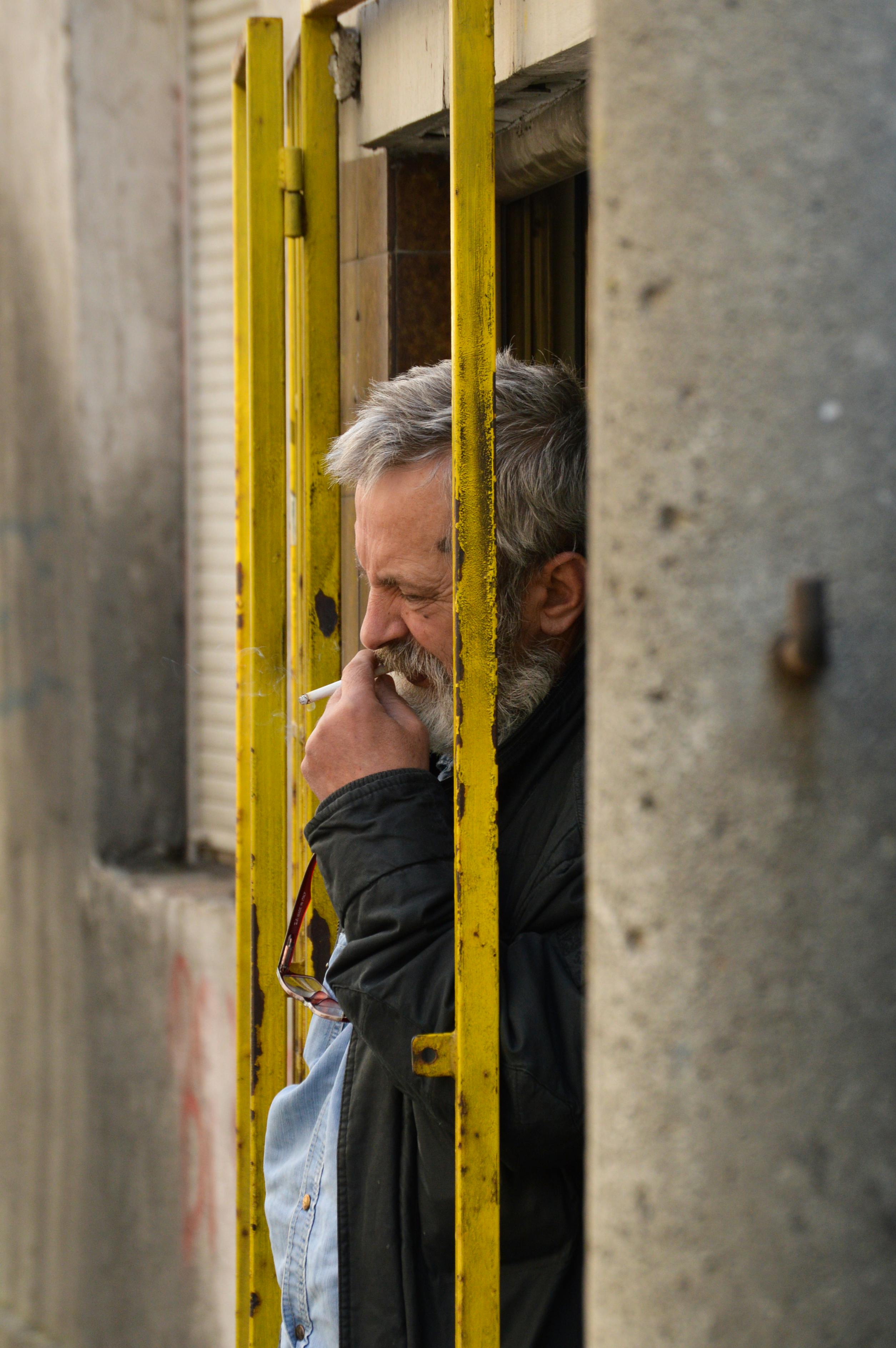 Elderly Man Smoking Cigarette · Free Stock Photo
