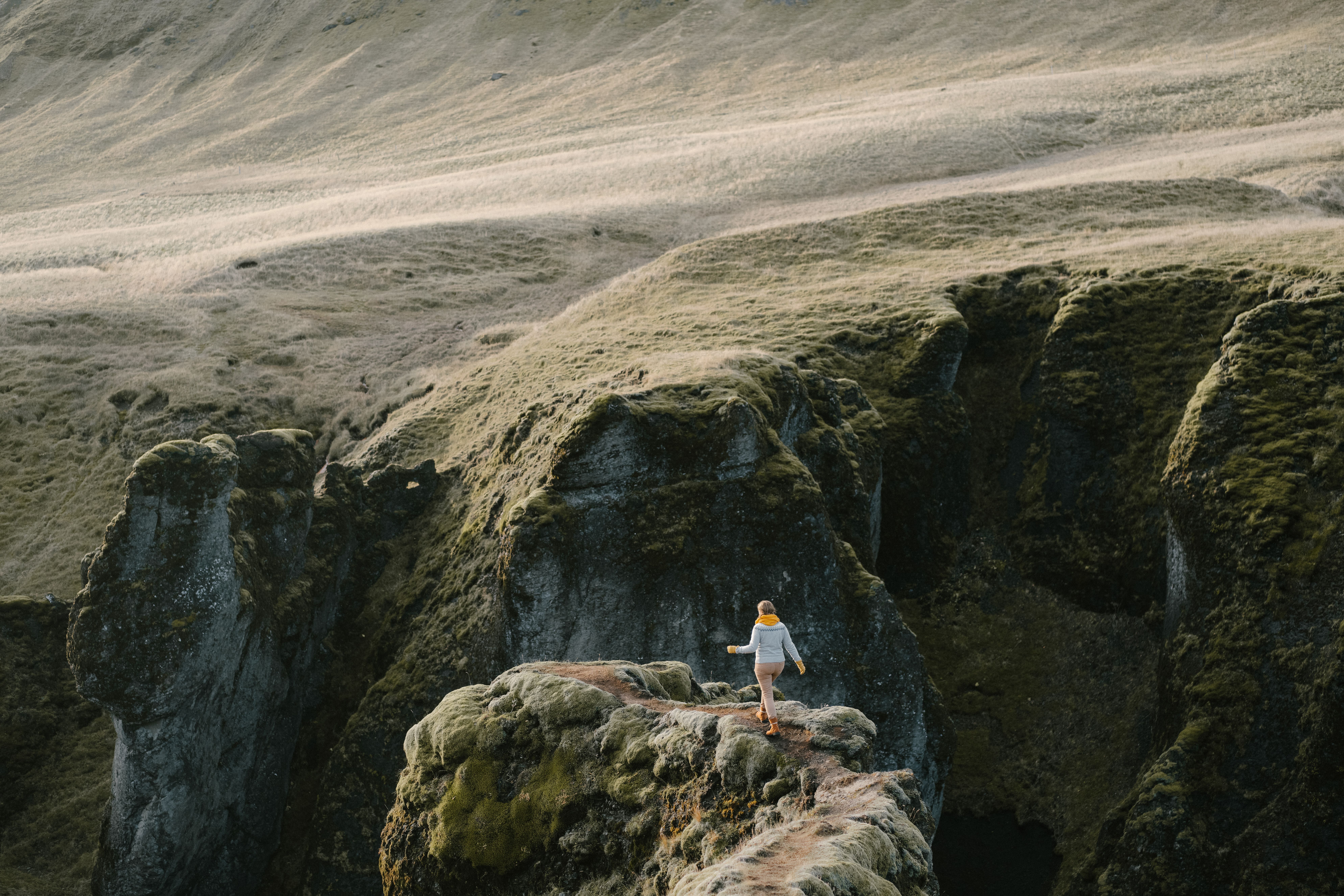 Person Walking Near Cliffs · Free Stock Photo