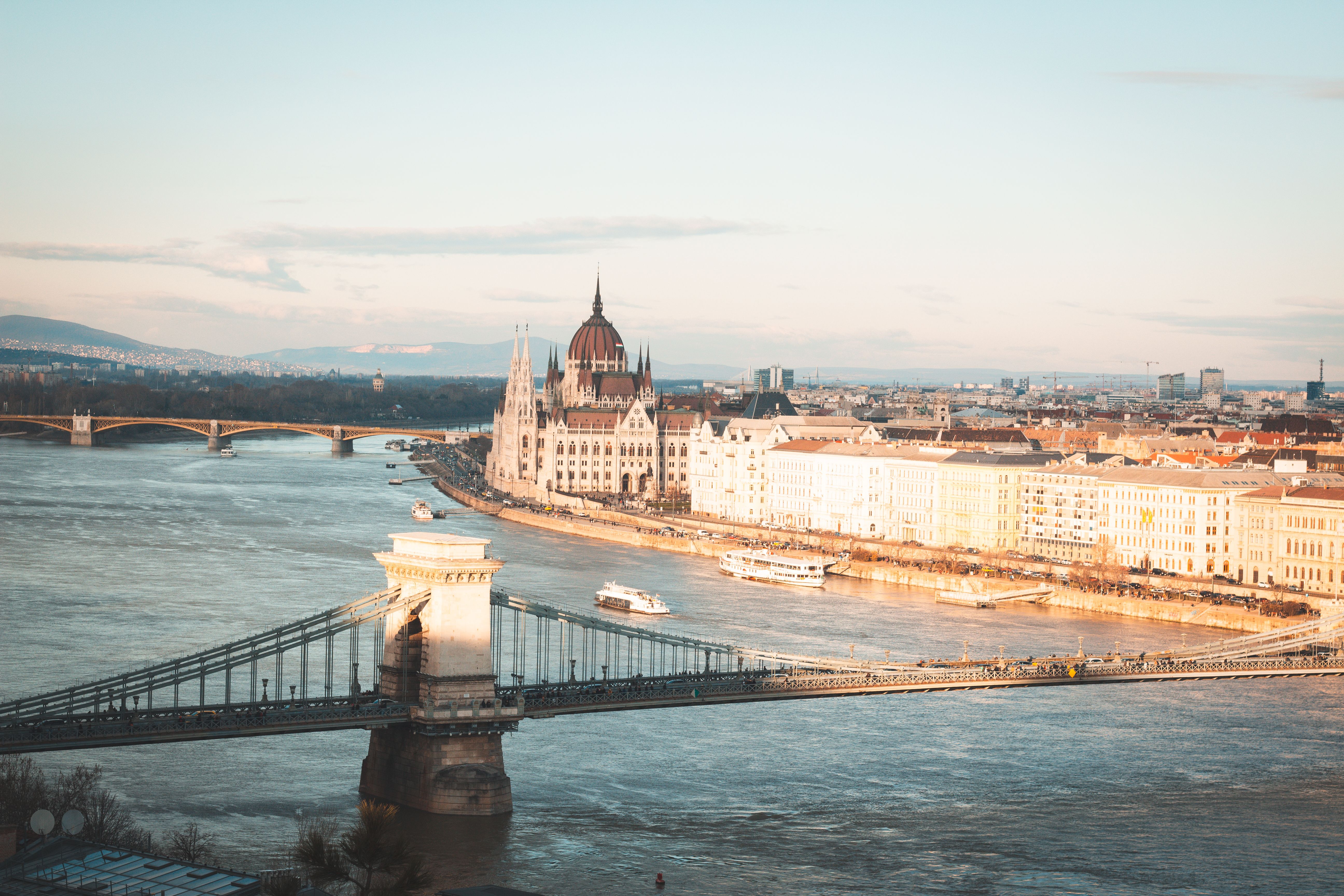 Old bridges over long river in historic city district · Free Stock Photo