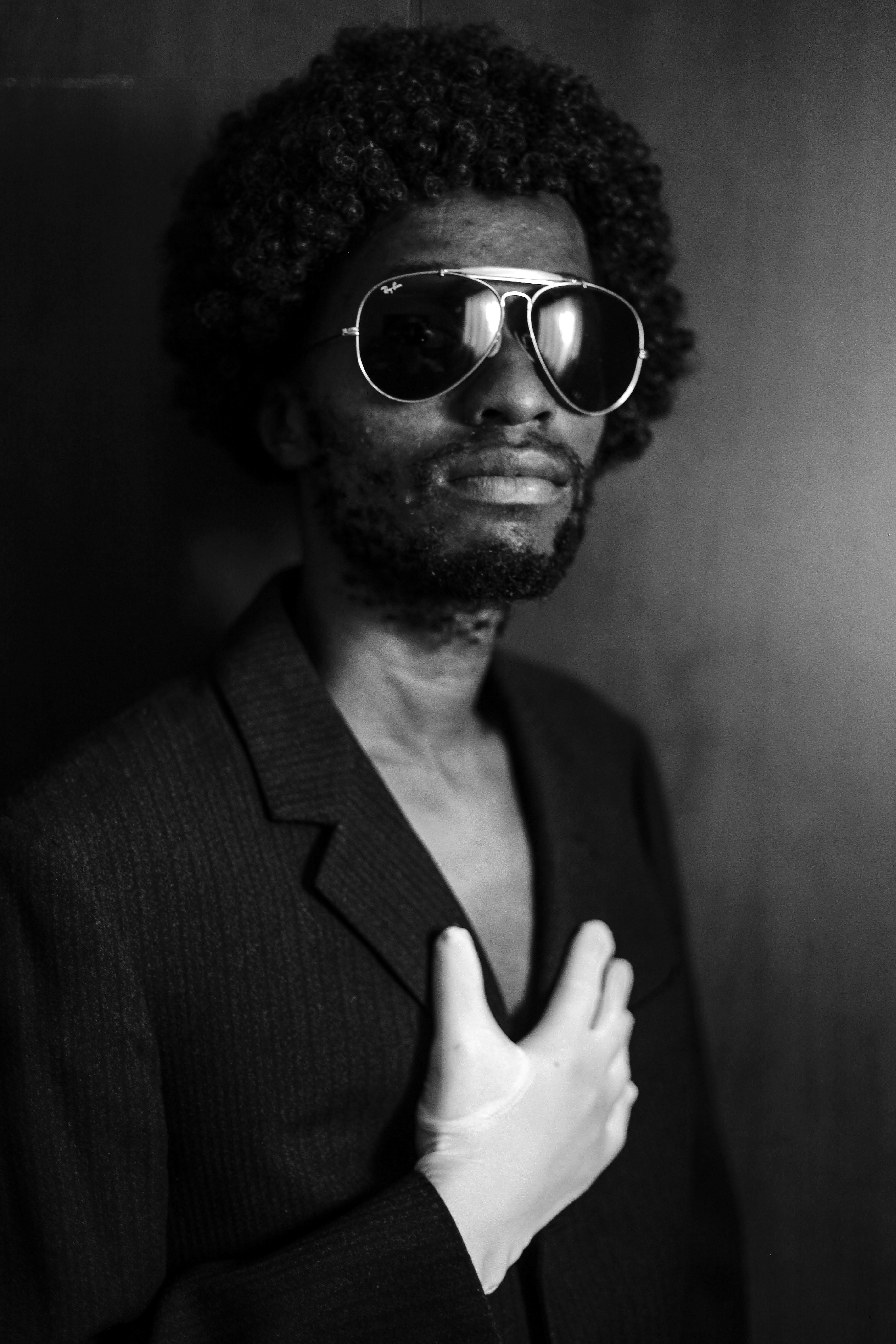 Man in White Blazer Holding Red Thread · Free Stock Photo