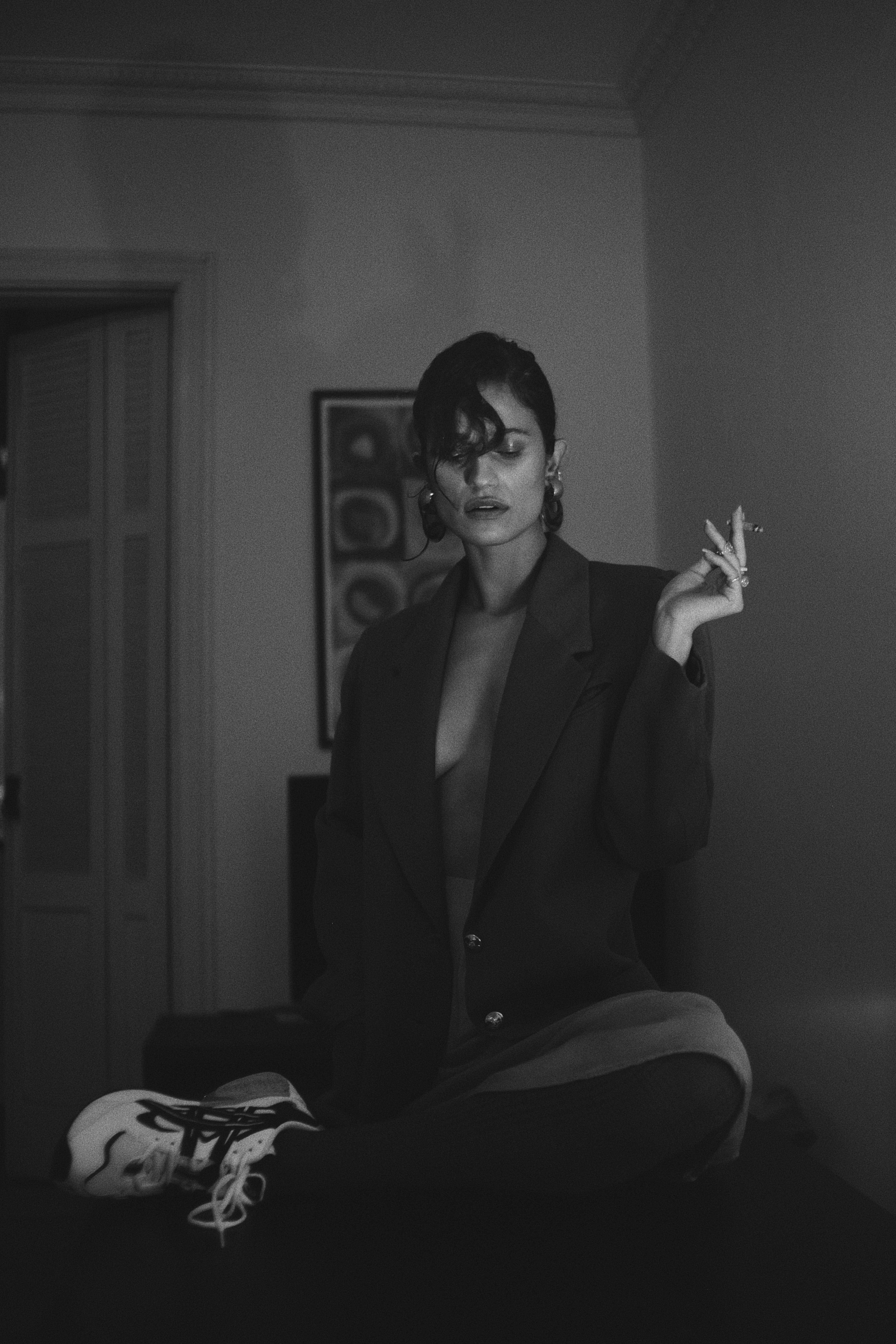 A Woman Smoking while Sitting on a Chair · Free Stock Photo