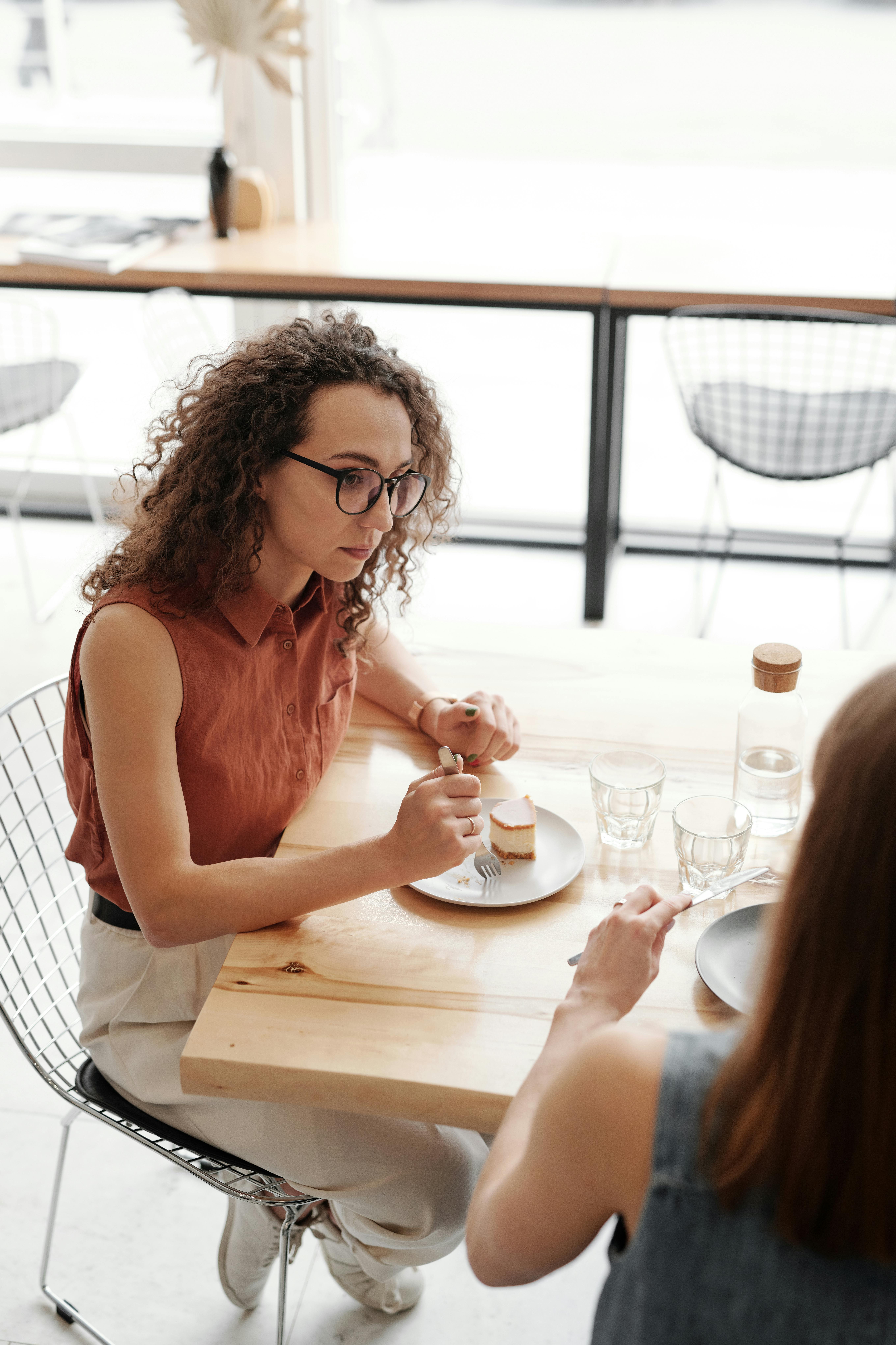 Women Drinking Coffee in Cafeteria · Free Stock Photo