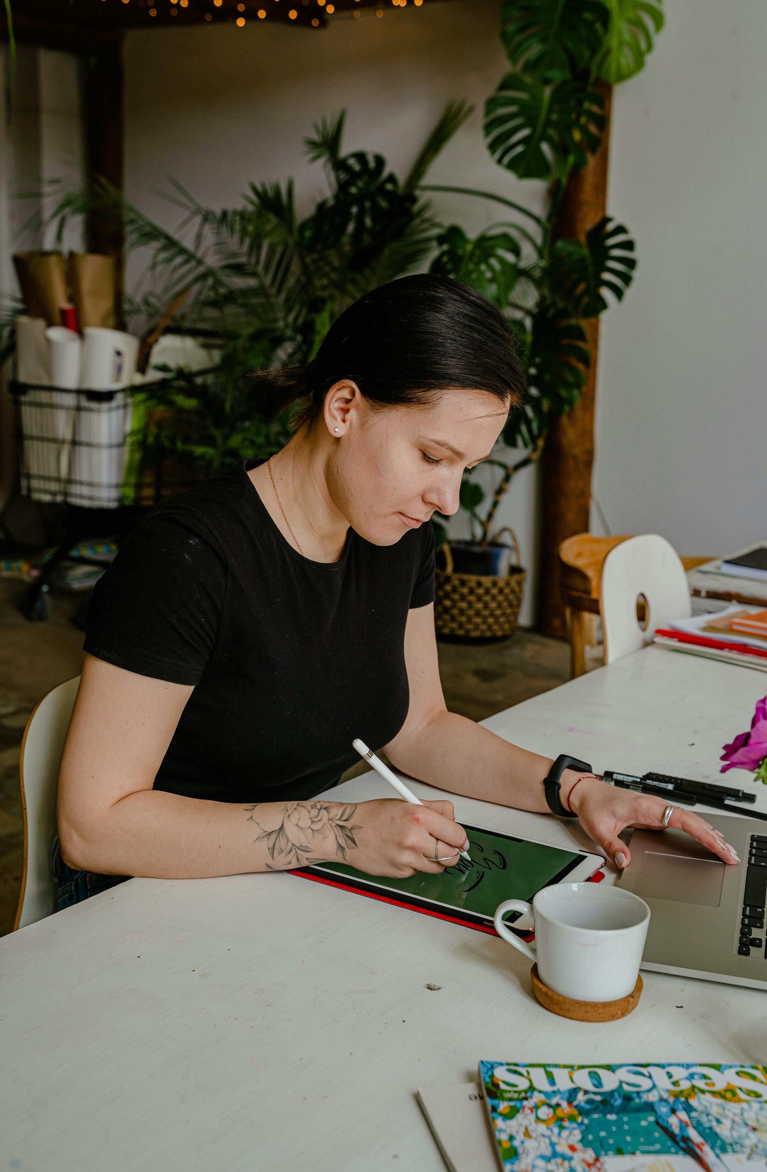 Person Drawing on a Tablet · Free Stock Photo