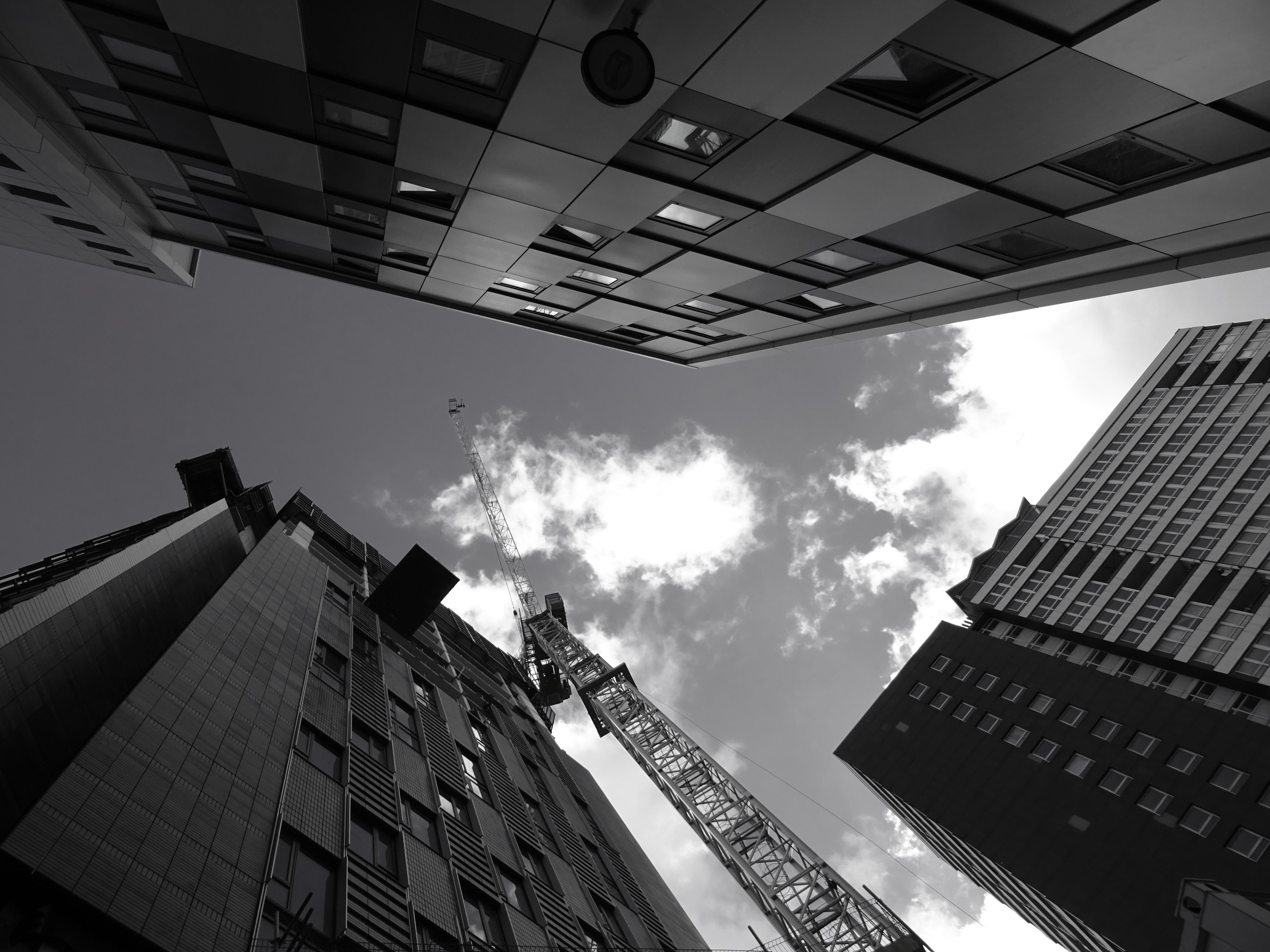 Concrete Buildings Under Cloudy Sky · Free Stock Photo