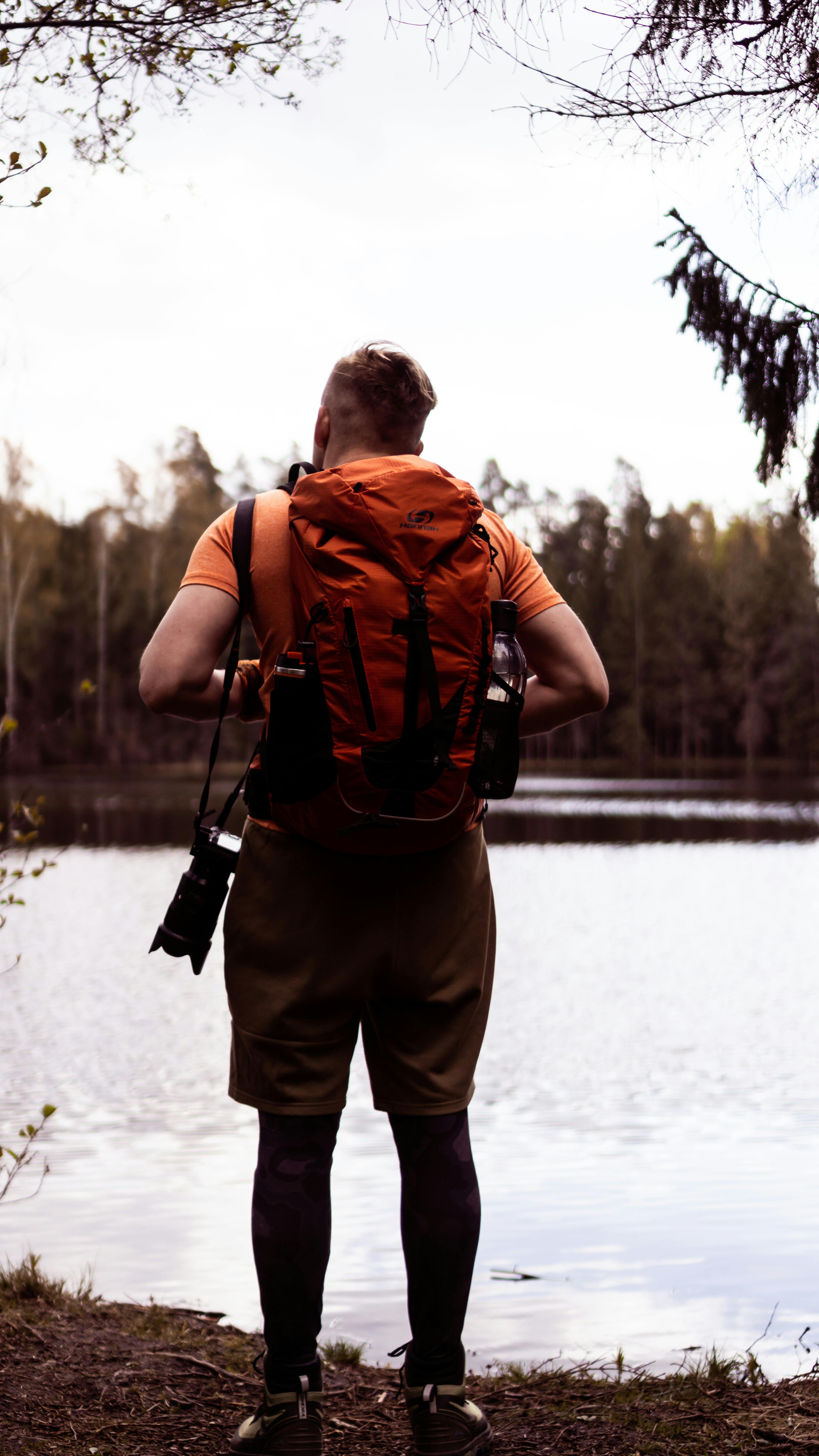 Photo of Man Standing While Carrying a Backpack · Free Stock Photo