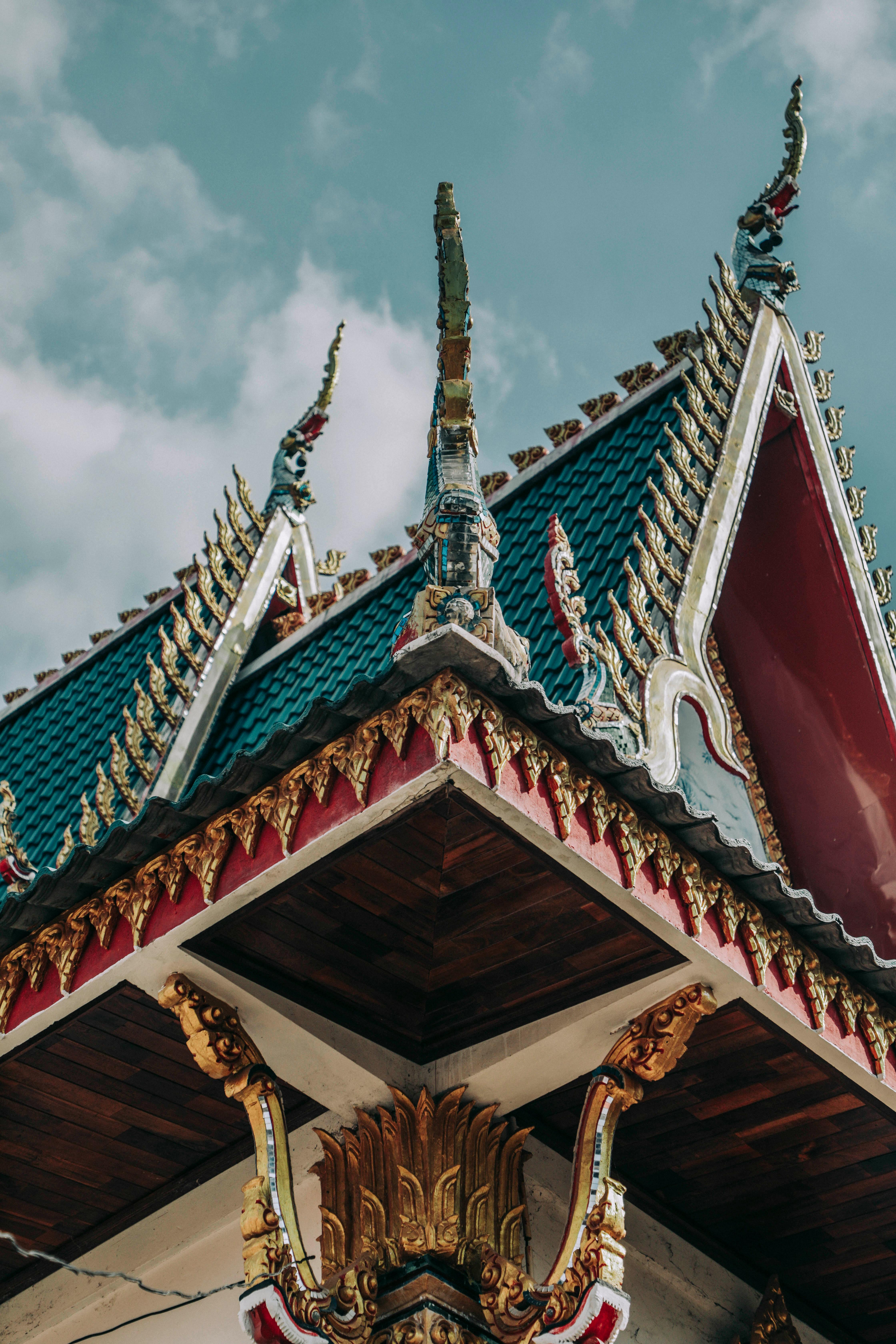 Decorative elements on facade of old Asian church · Free Stock Photo
