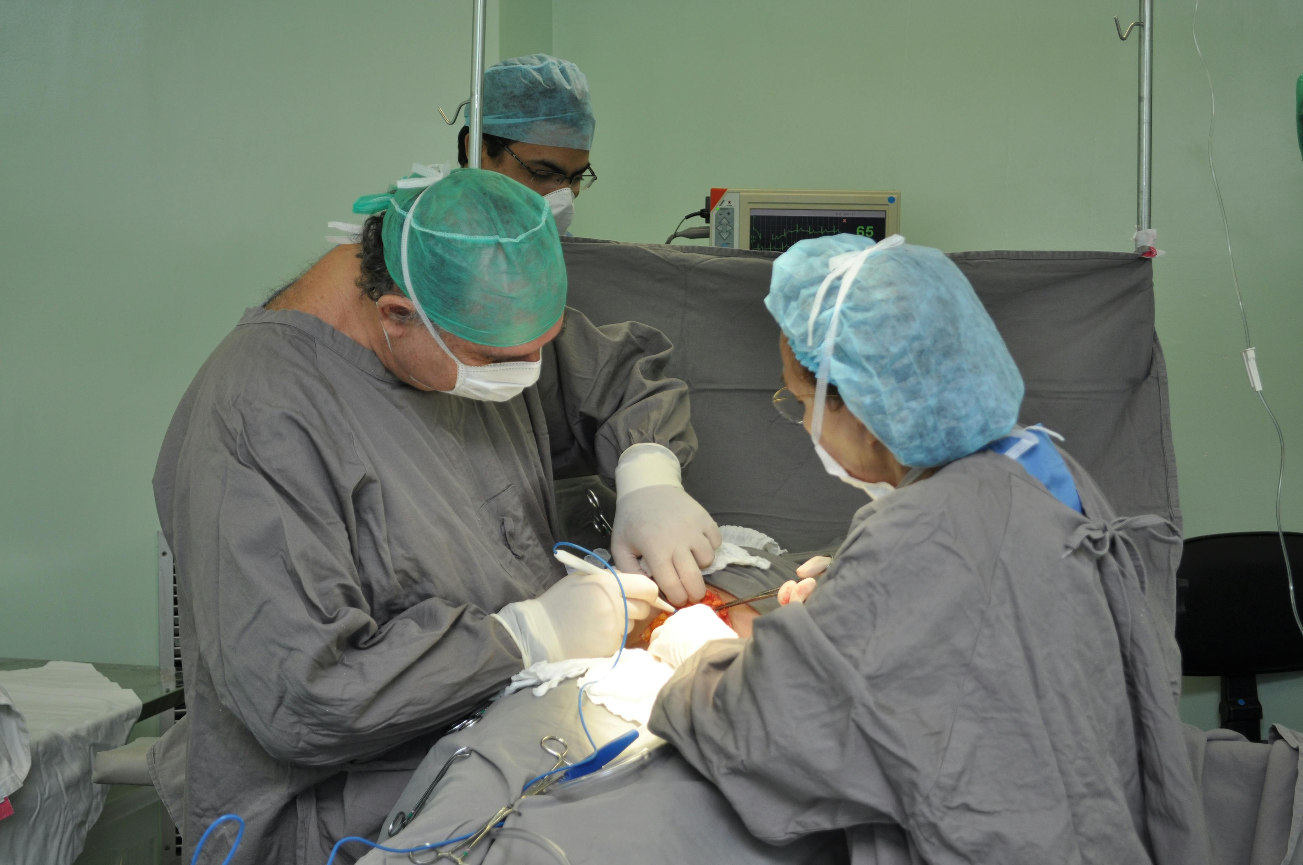 Two Person Doing Surgery Inside Room · Free Stock Photo