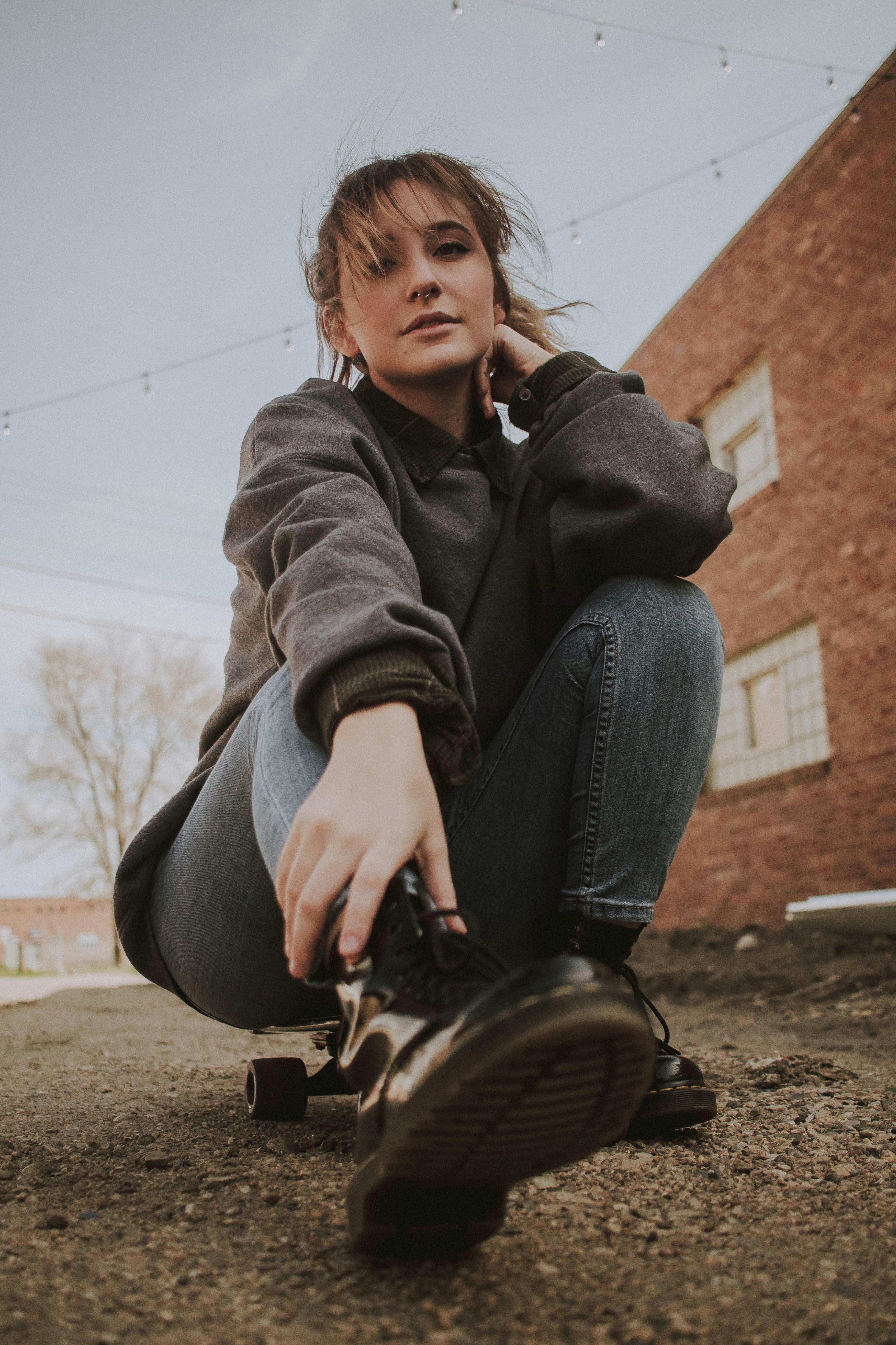 Photo of Women Smiling While Standing on Road · Free Stock Photo