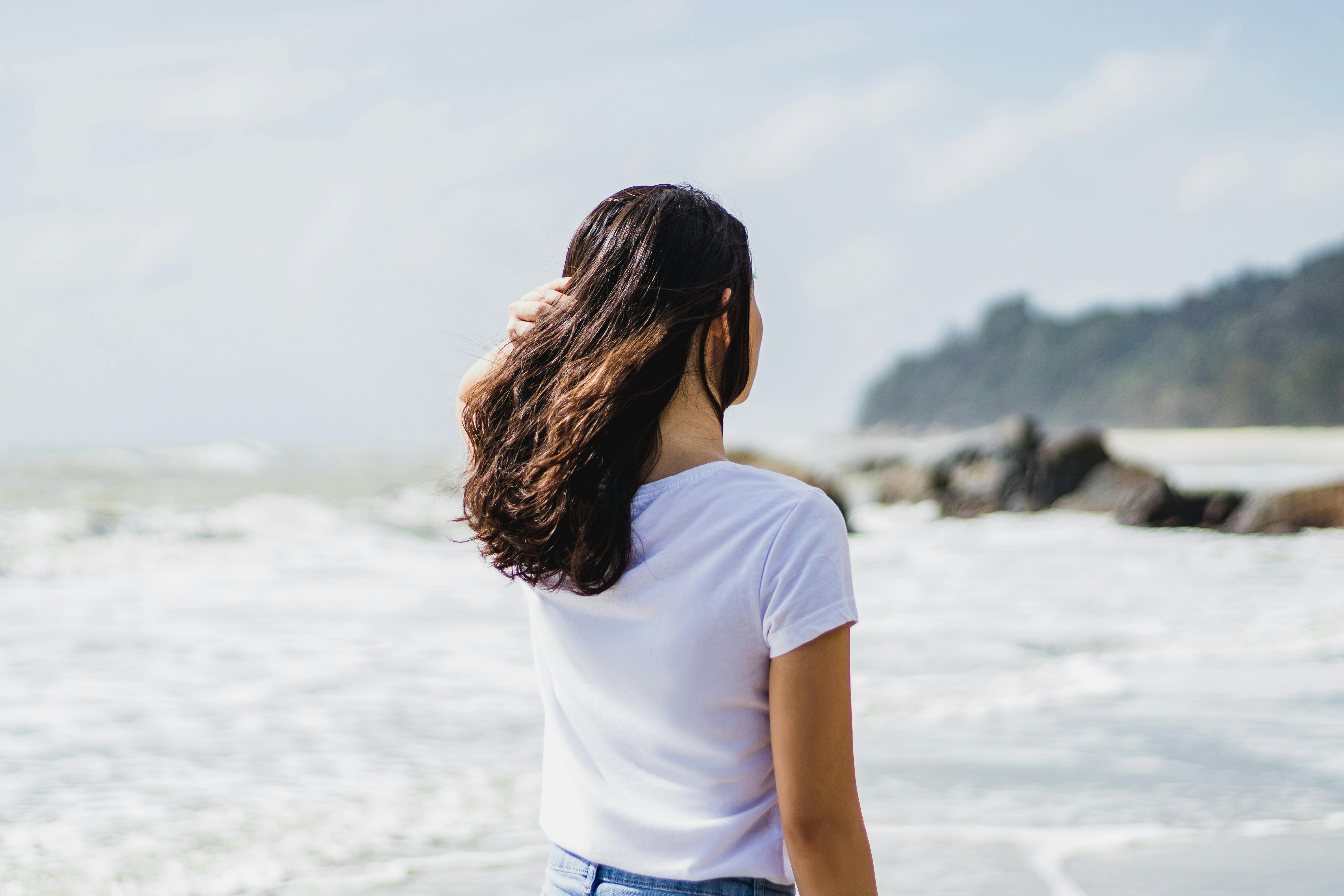 Back View of a Woman Posing at the Beach · Free Stock Photo