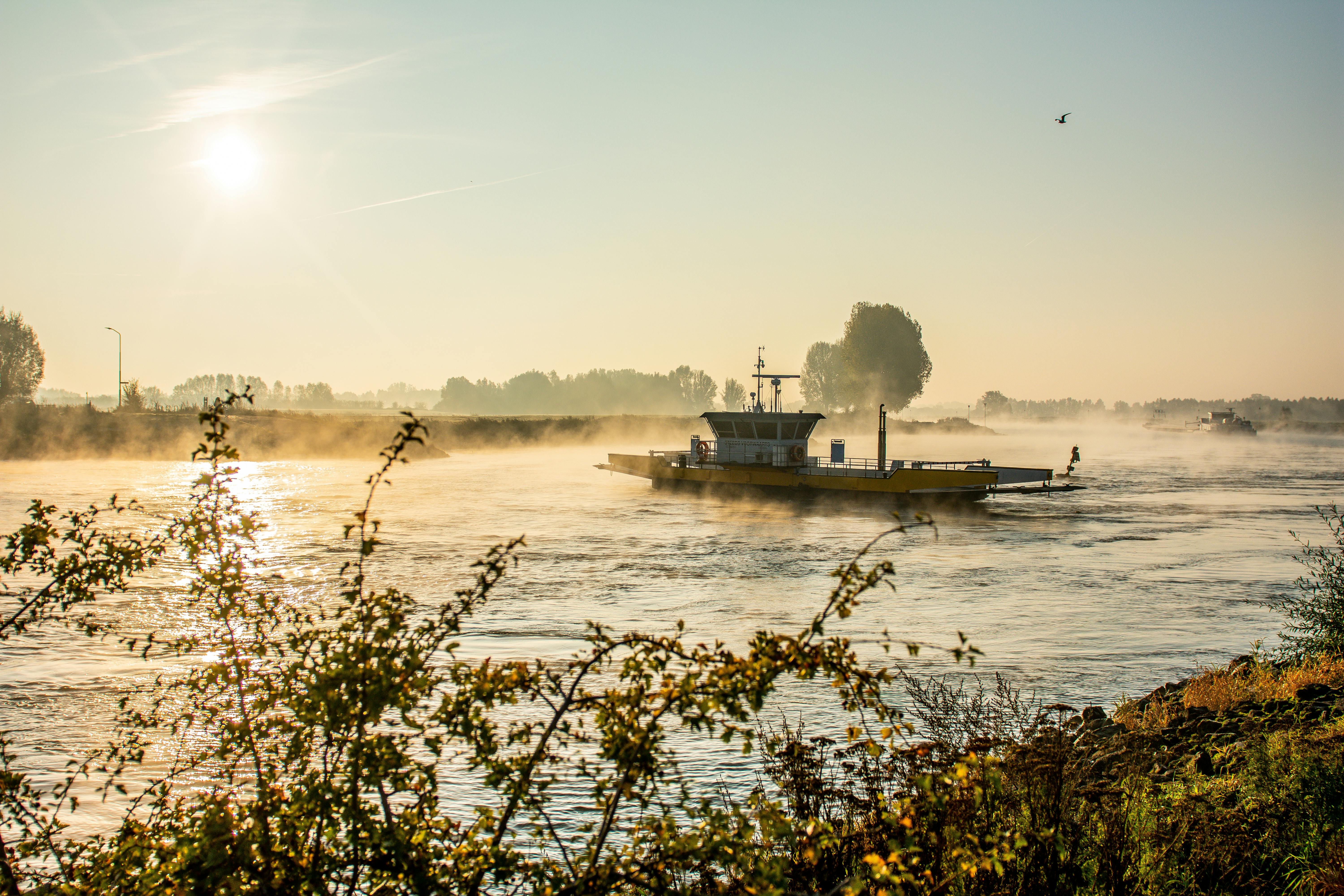 A Ferry Boat on a Misty Body of Water · Free Stock Photo