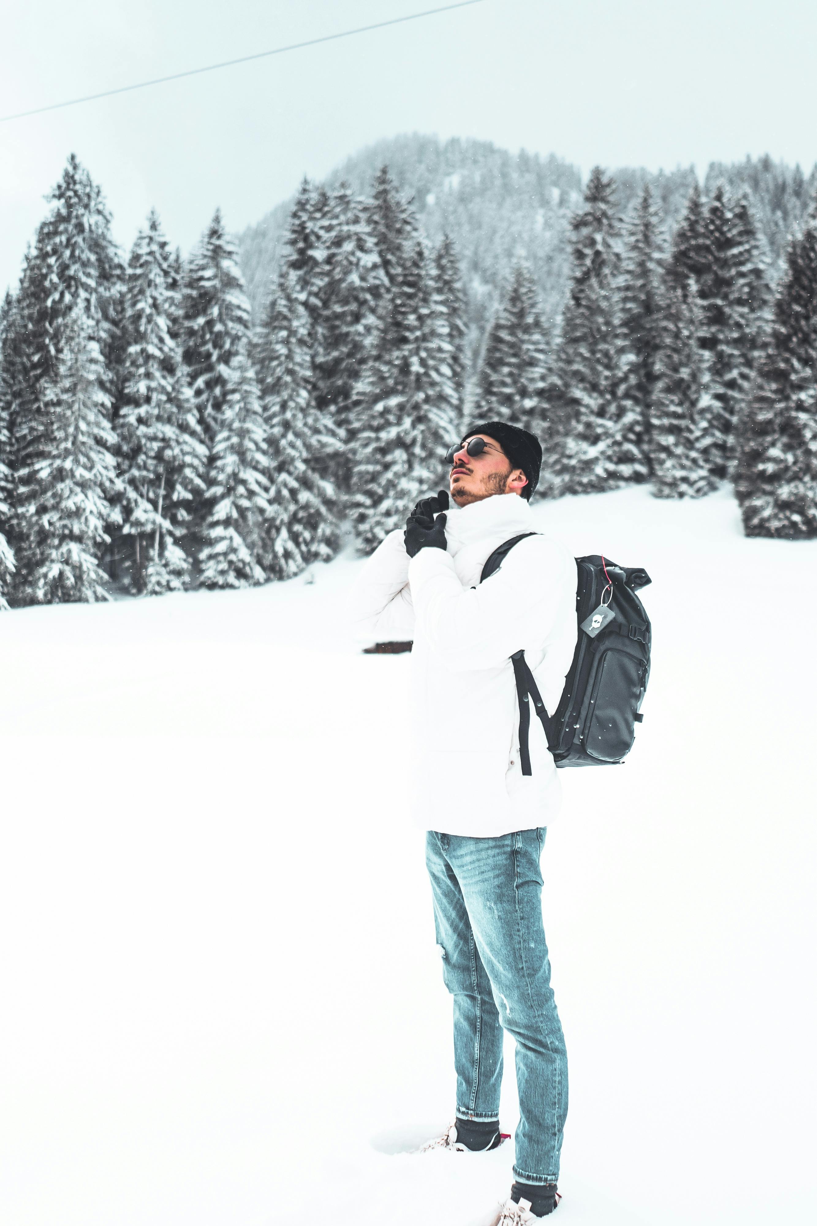 Man Standing on Snow Covered Ground · Free Stock Photo