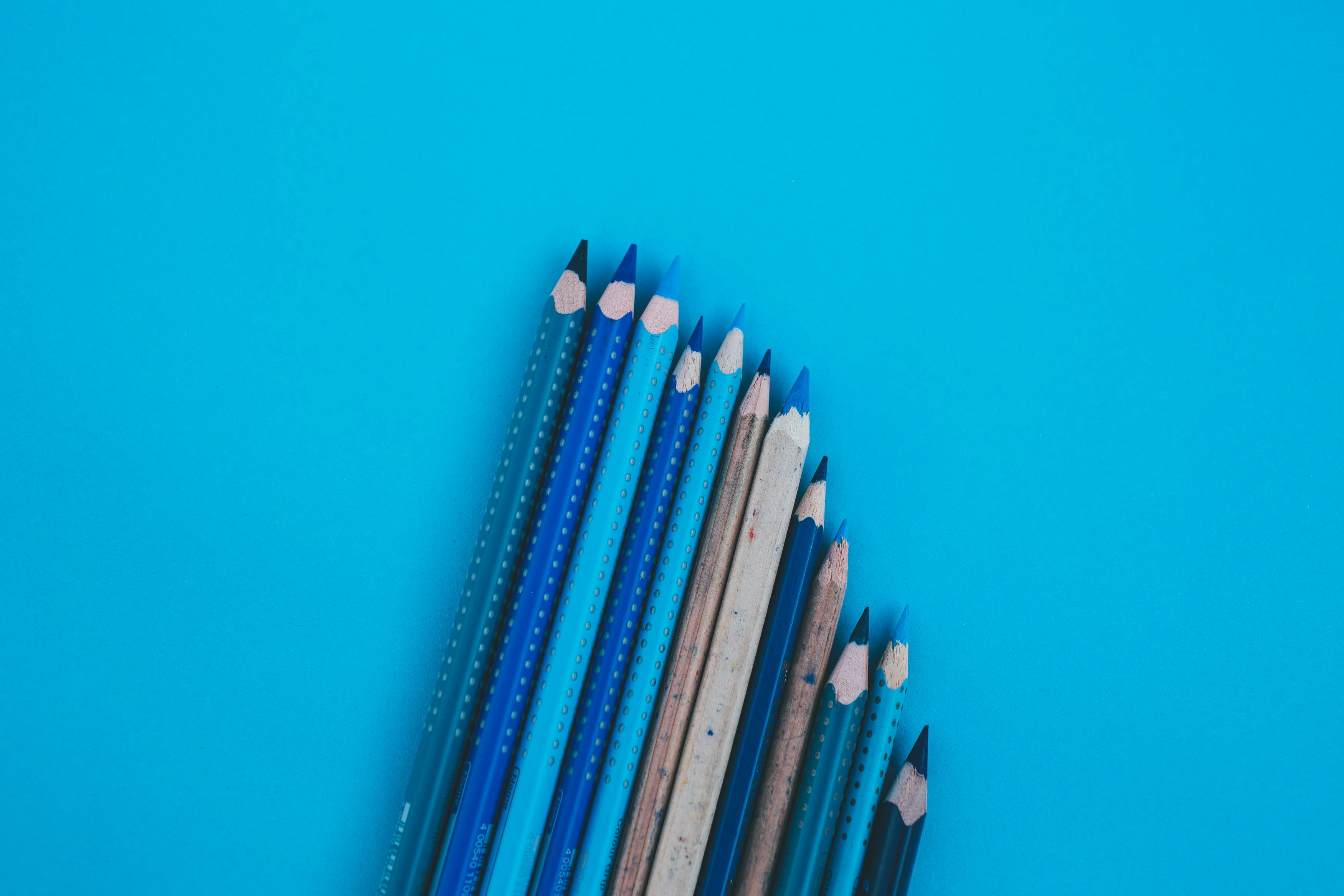 Different Shades of Blue Colored Pencils on a Blue Background · Free ...