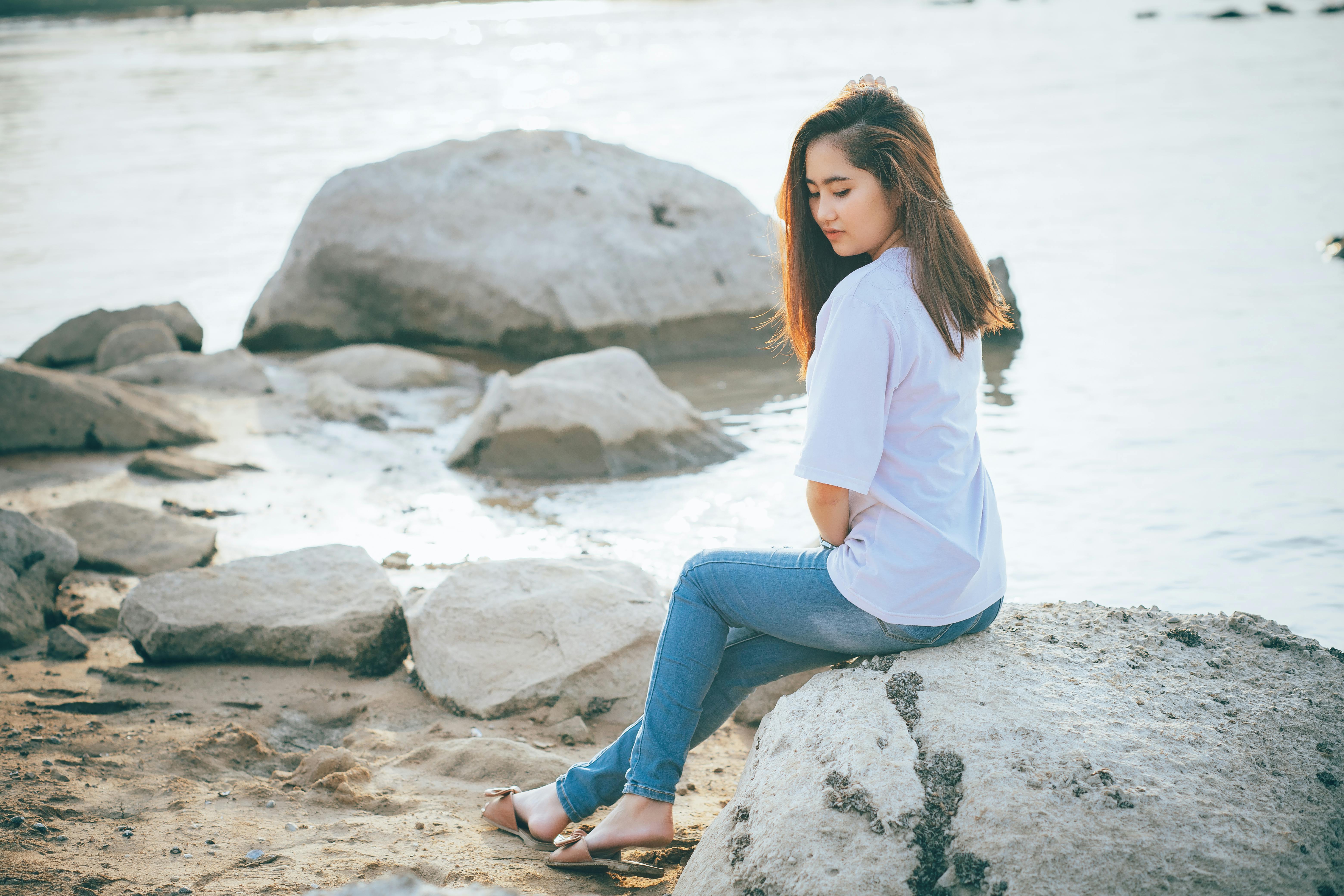 Calm Asian woman near river in summer · Free Stock Photo