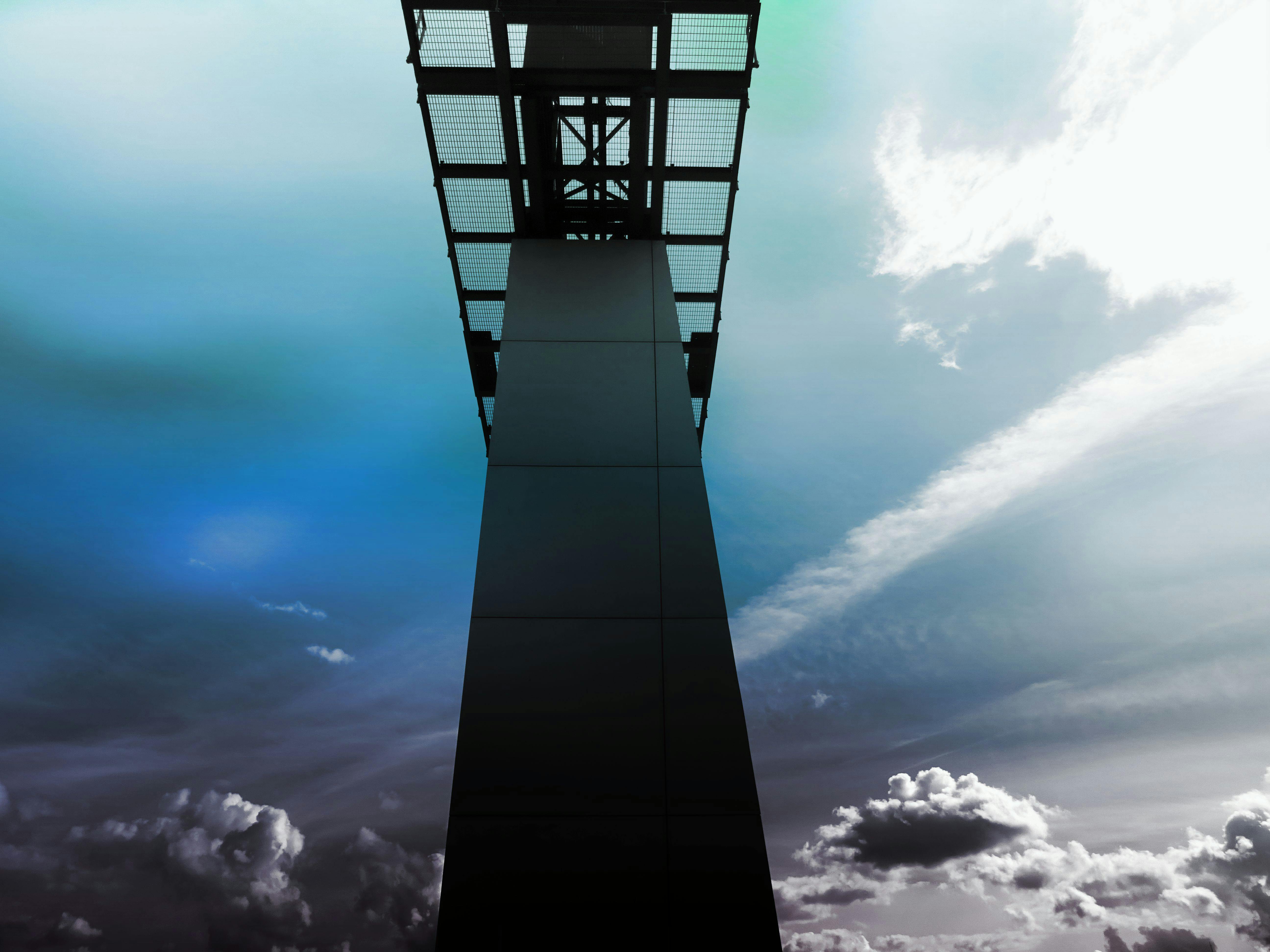 Grey Concrete Structure Under Cloudy Sky · Free Stock Photo