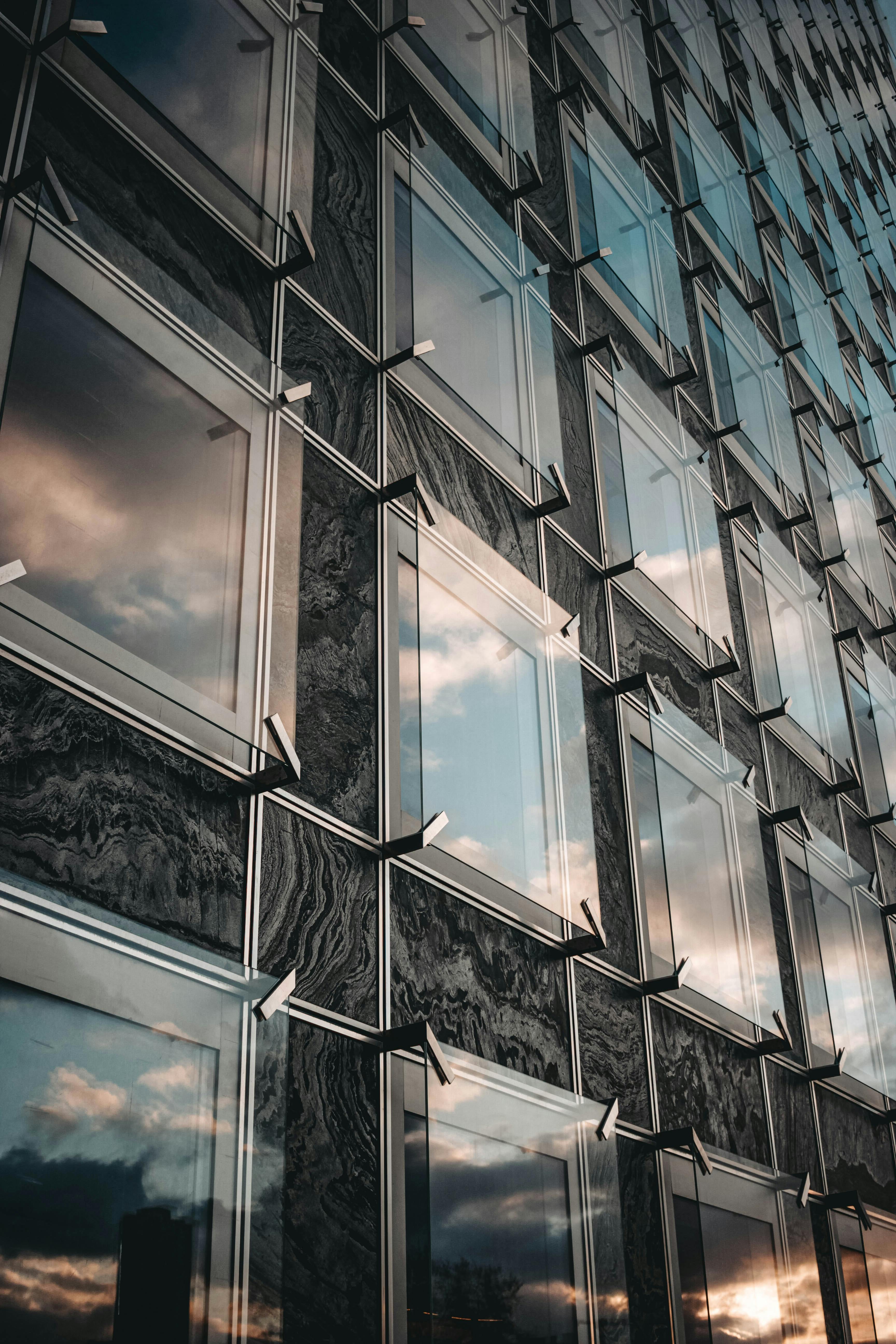 Modern glass building with square glass elements · Free Stock Photo