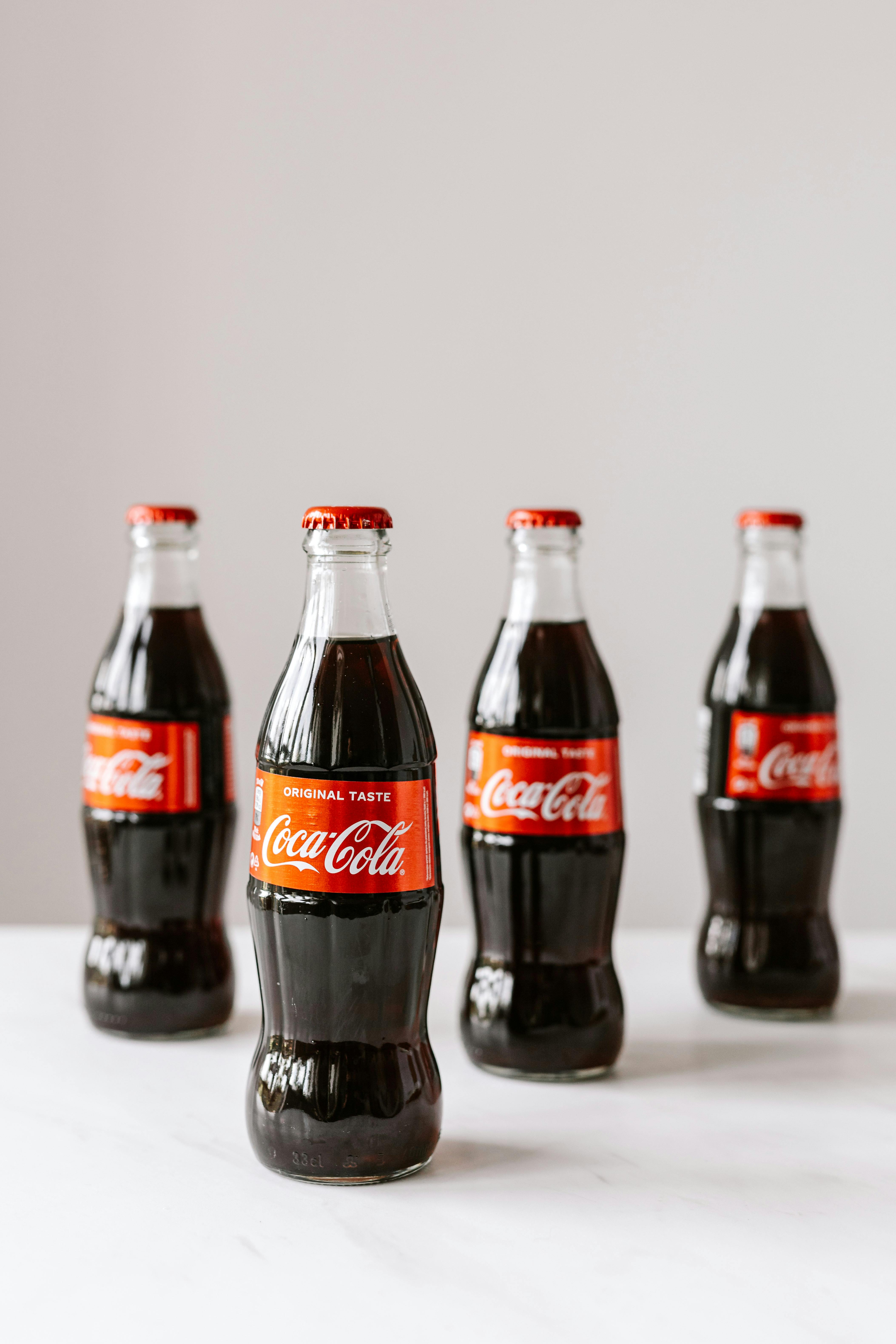 Fresh soft coke drink on white surface · Free Stock Photo