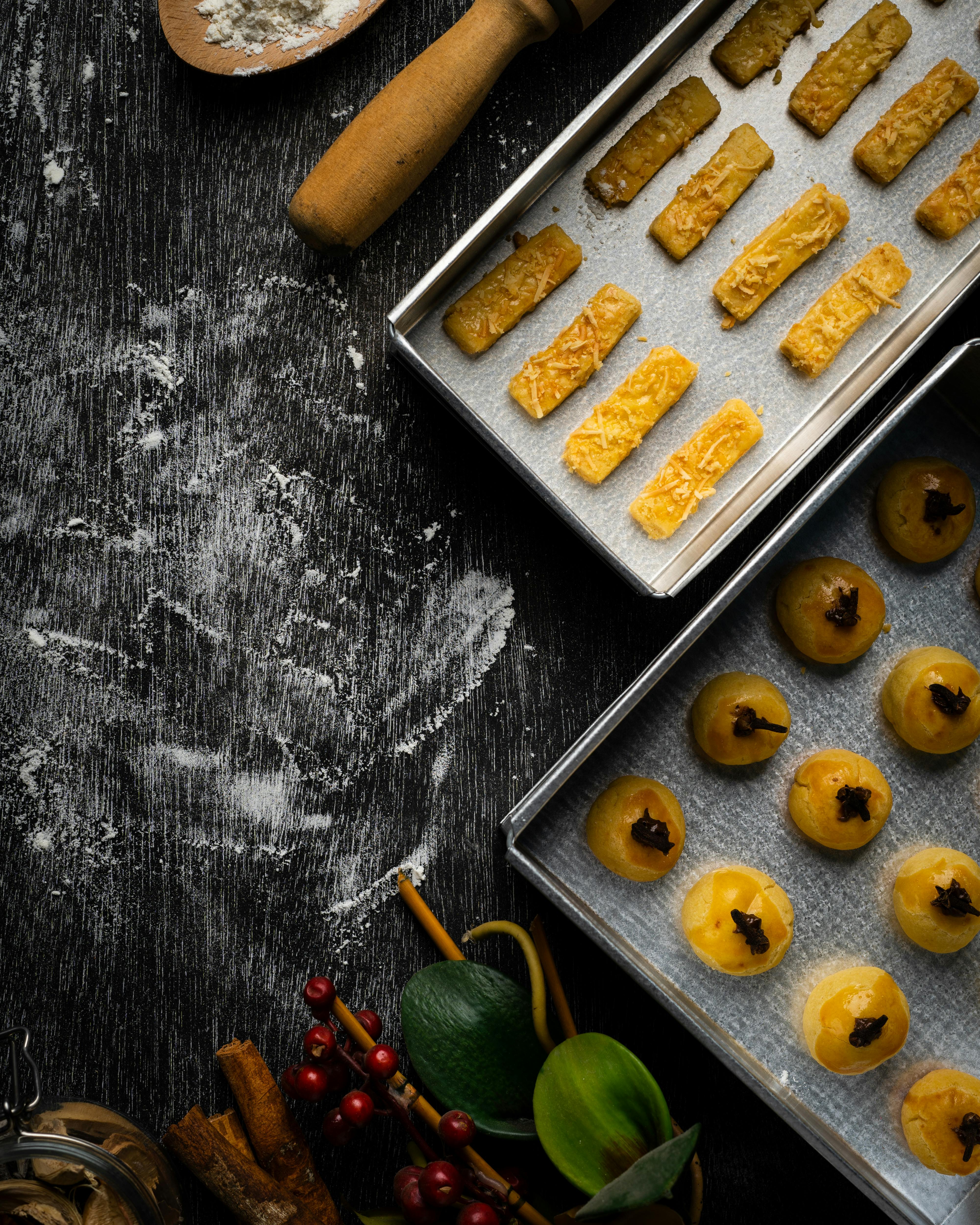 Assorted cookies placed on trays before baking · Free Stock Photo