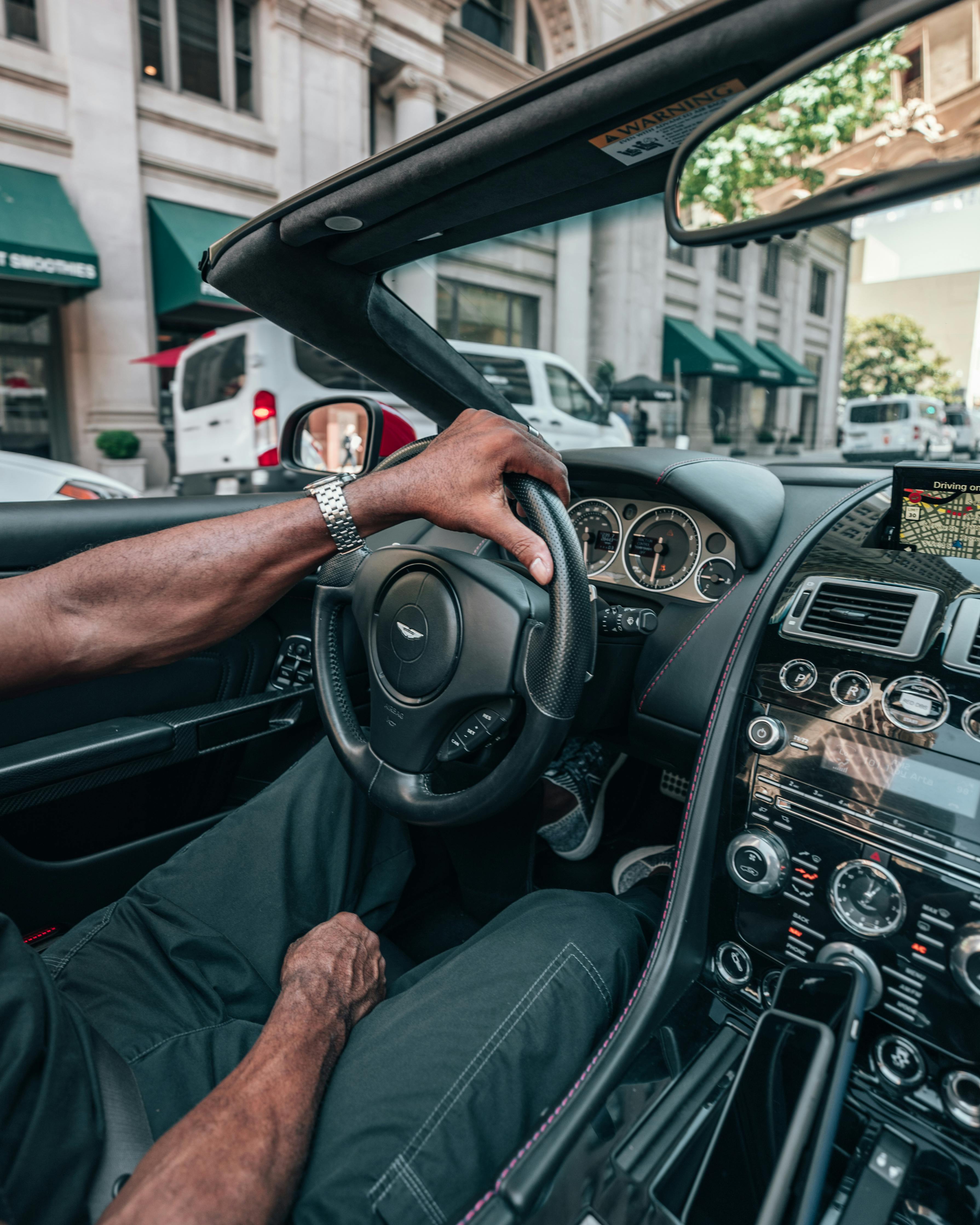 A Black Car Driving During Golden Hour · Free Stock Photo