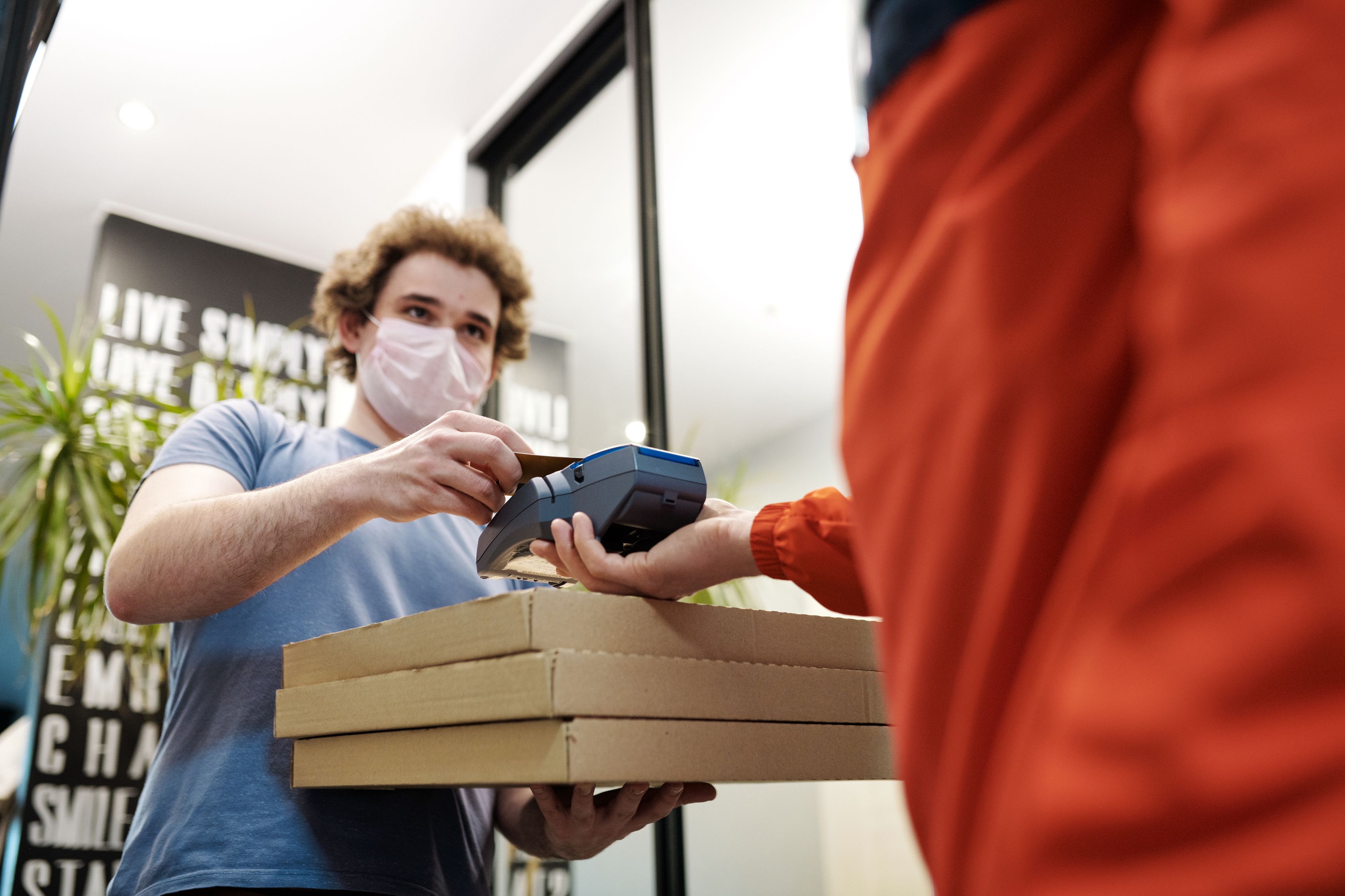 Man Wearing A Face Mask Paying For Pizza Delivery Free Stock Photo Man Wearing A Face Mask Paying For Pizza Delivery Free Stock Photo