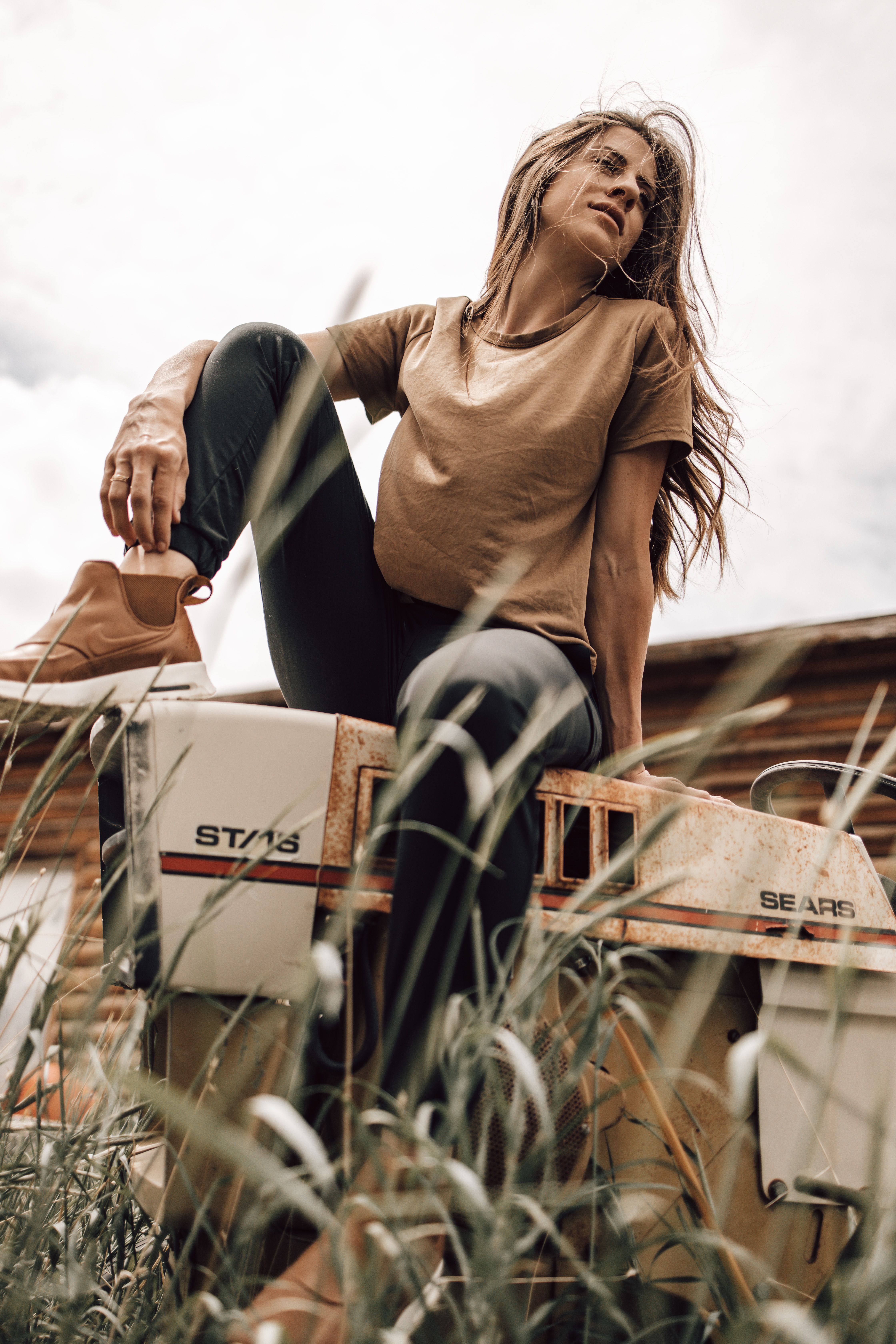A Back View of a Female Sitting · Free Stock Photo