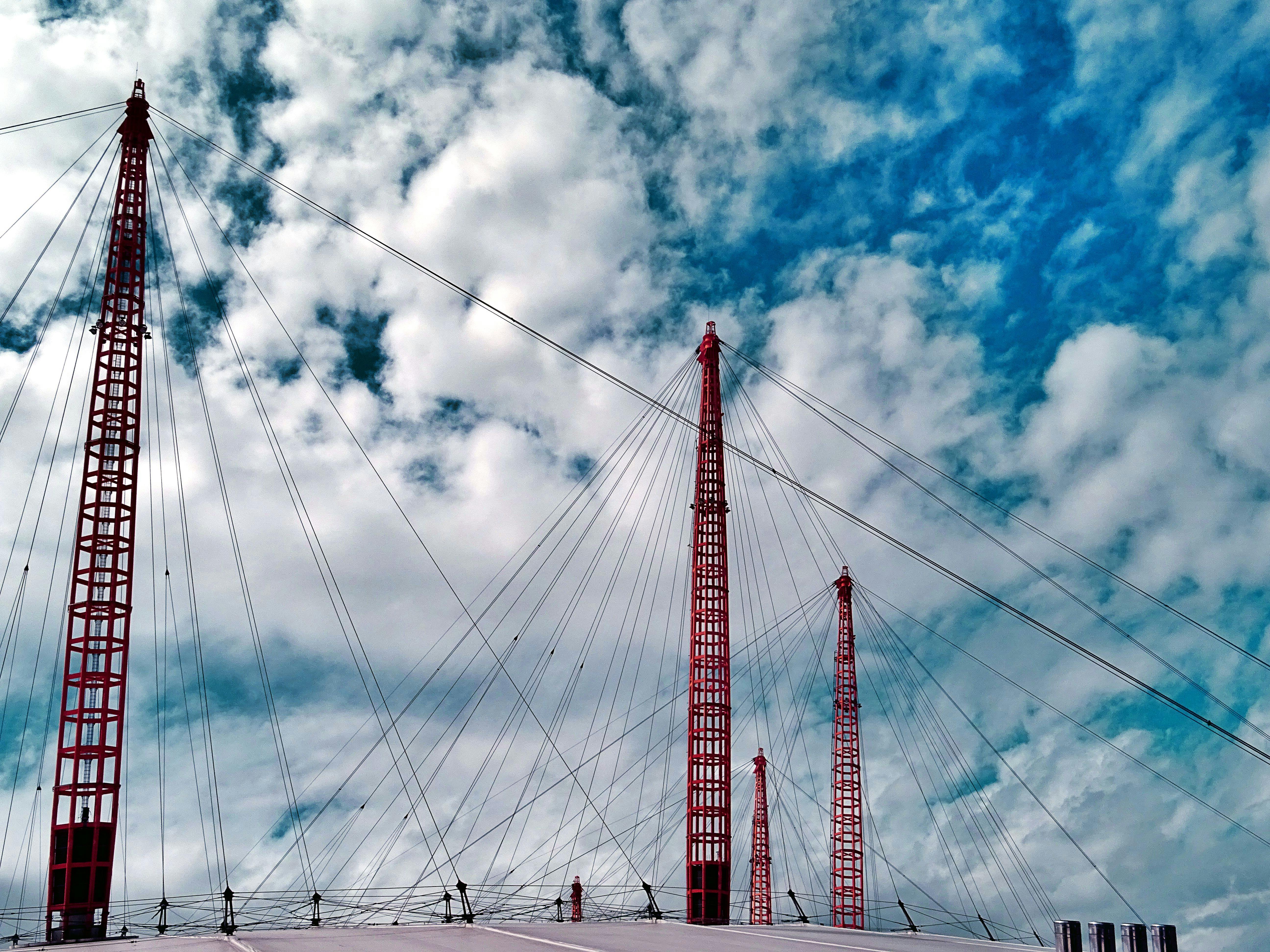 Red Power Lines Under White Clouds · Free Stock Photo