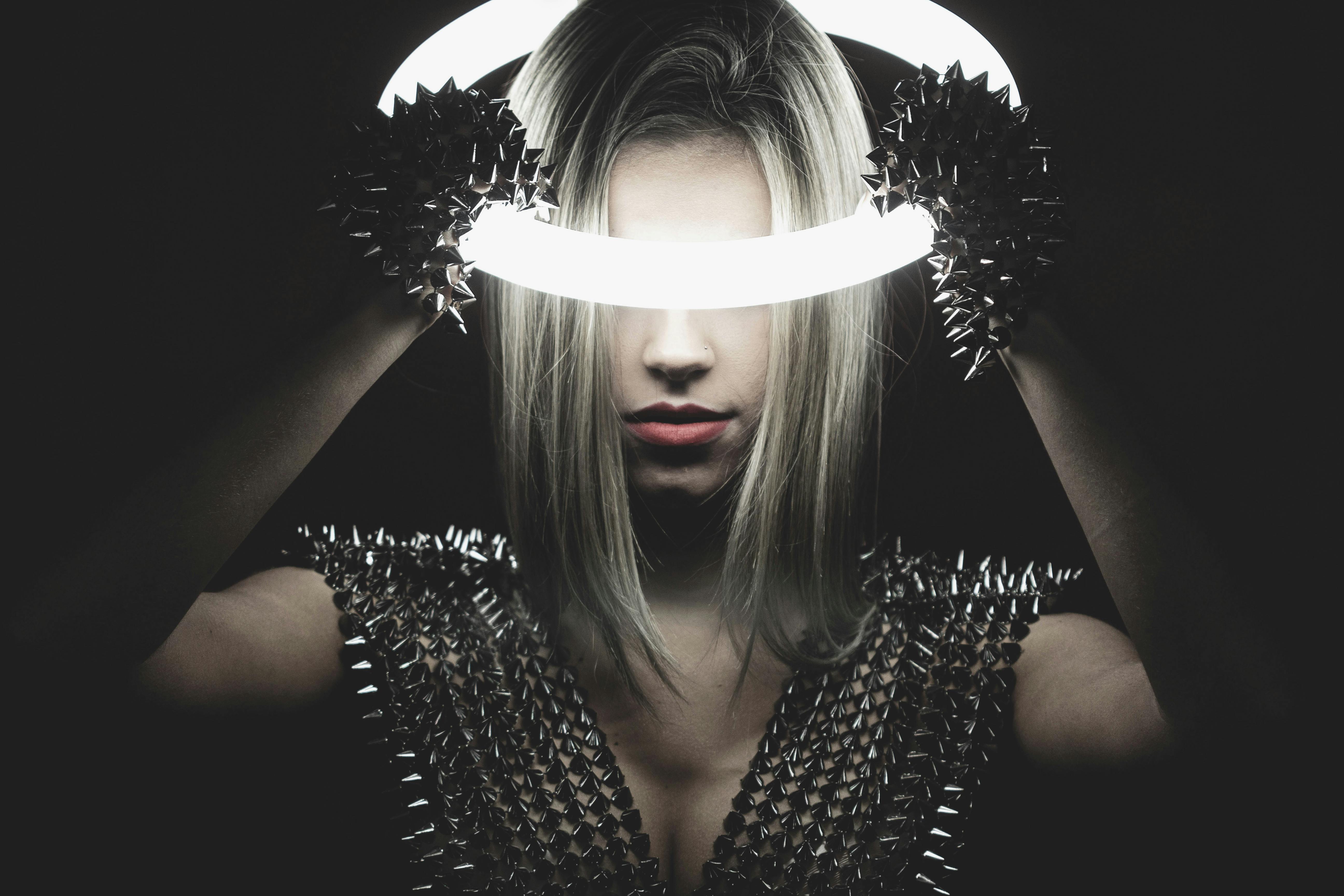 Woman Holding a Ring Light on Her Head · Free Stock Photo
