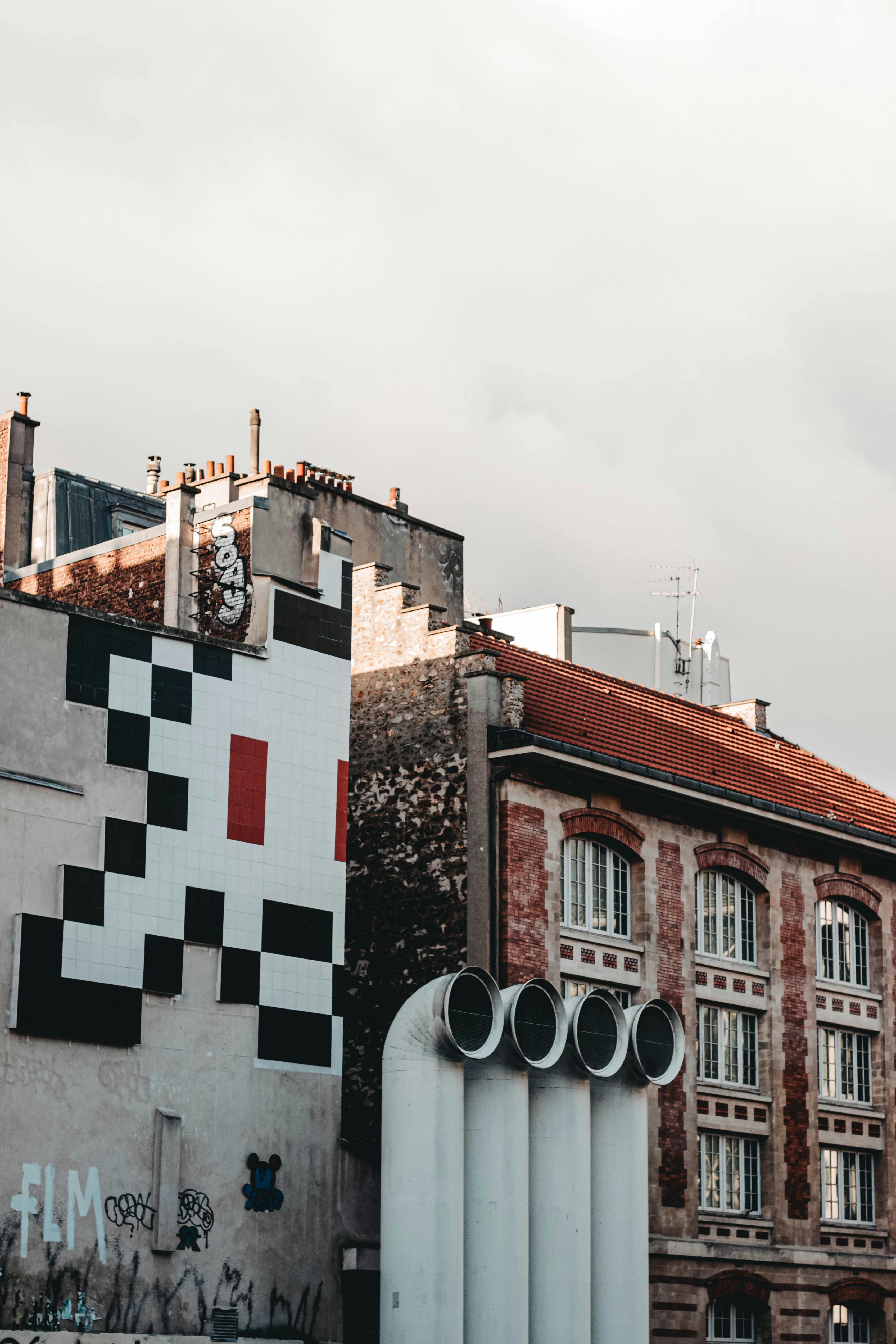 Facade of old building with wall with graffiti · Free Stock Photo