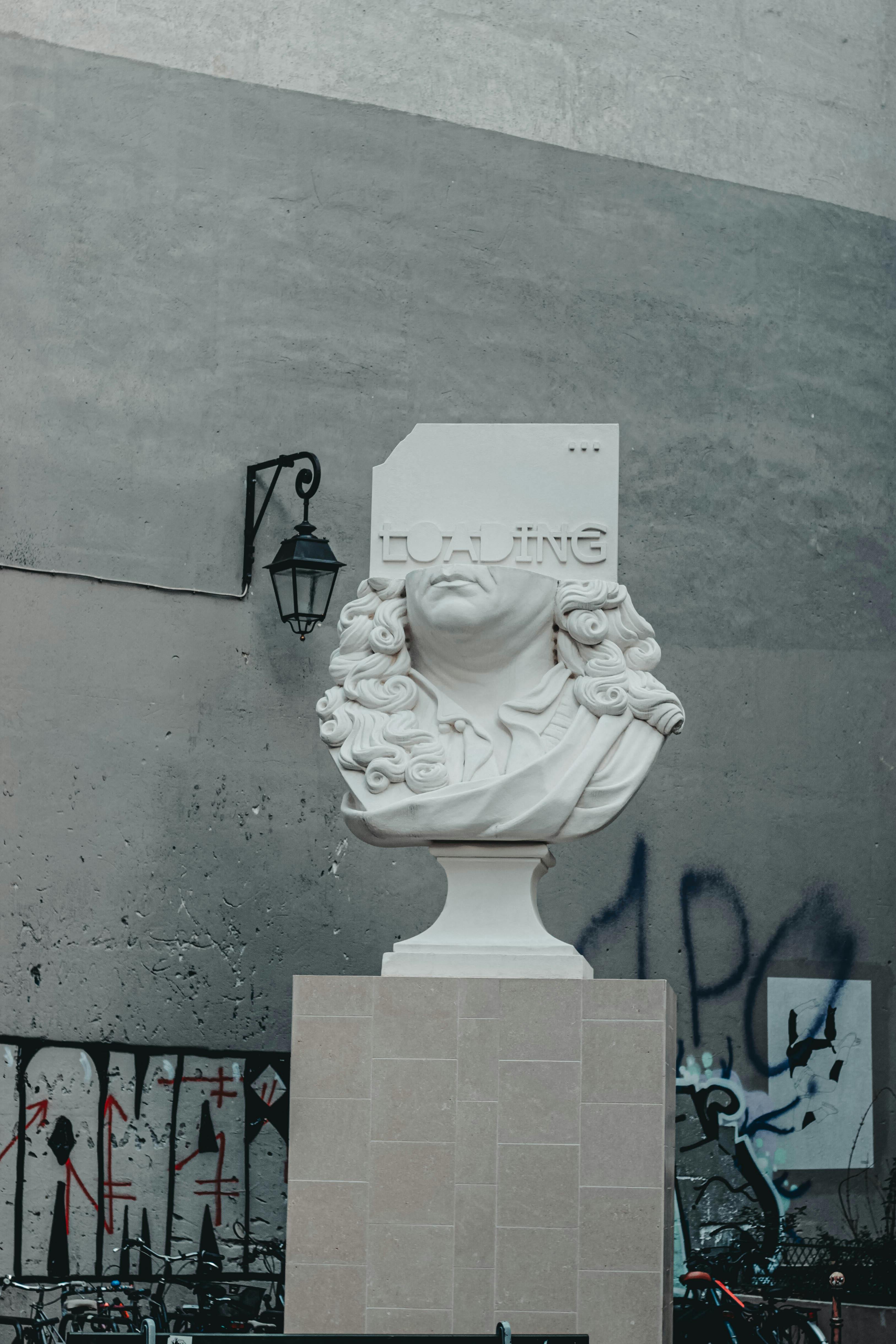 Bust sculpture with bandaged eyes and blood tears · Free Stock Photo
