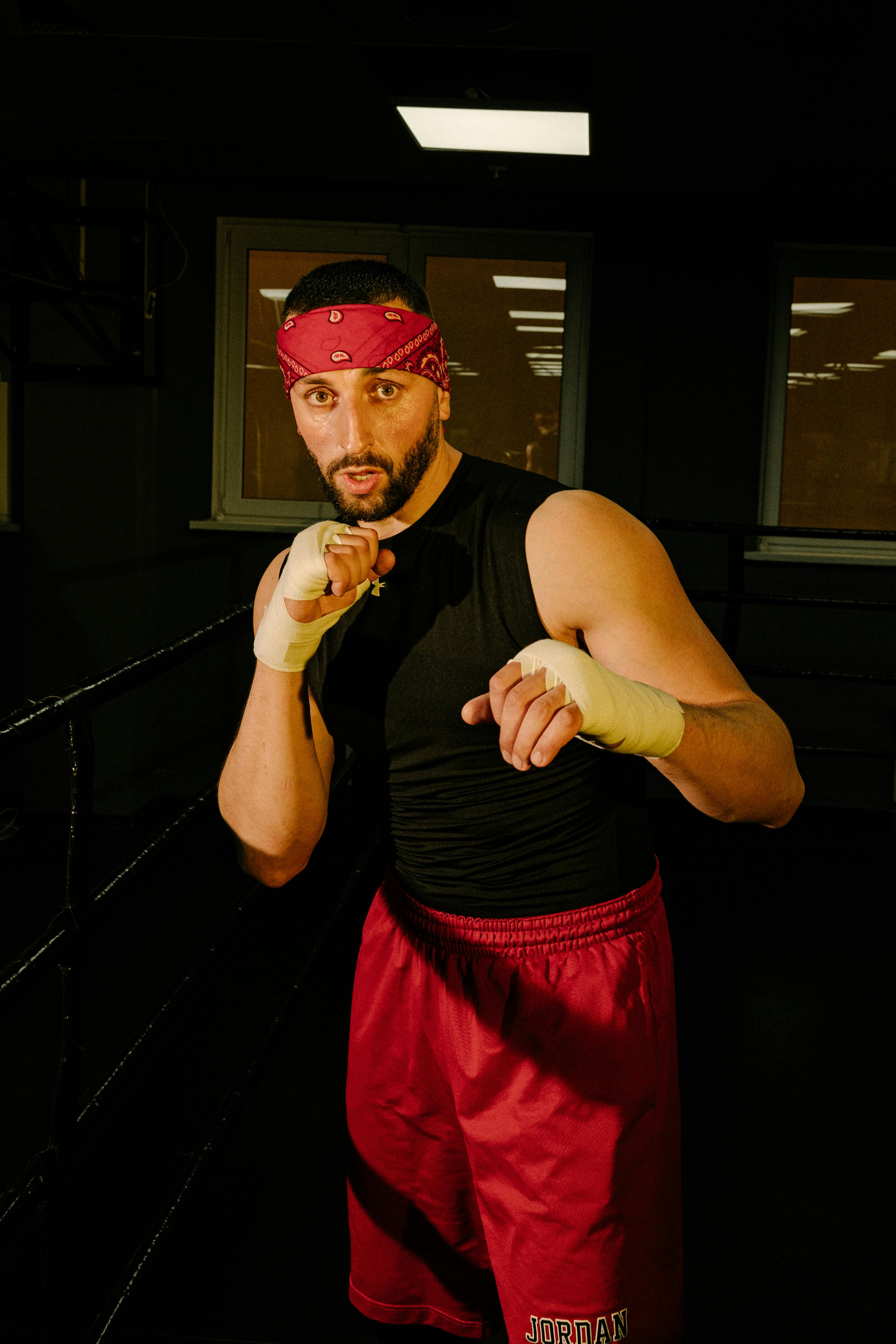 Man Standing On Boxing Ring Wearing Hand Wraps · Free Stock Photo