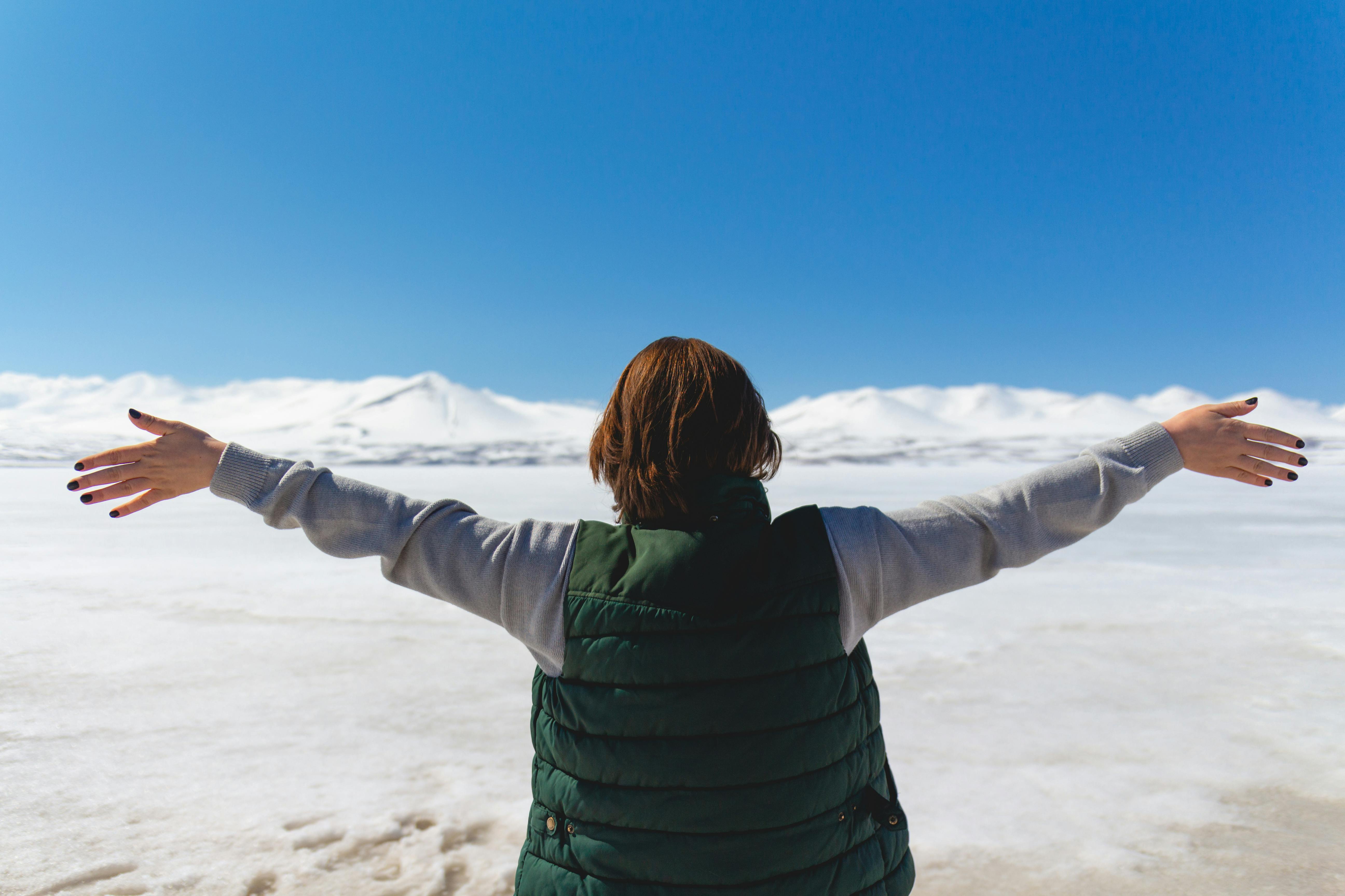 Back View of a Woman with Her Arms Apart · Free Stock Photo