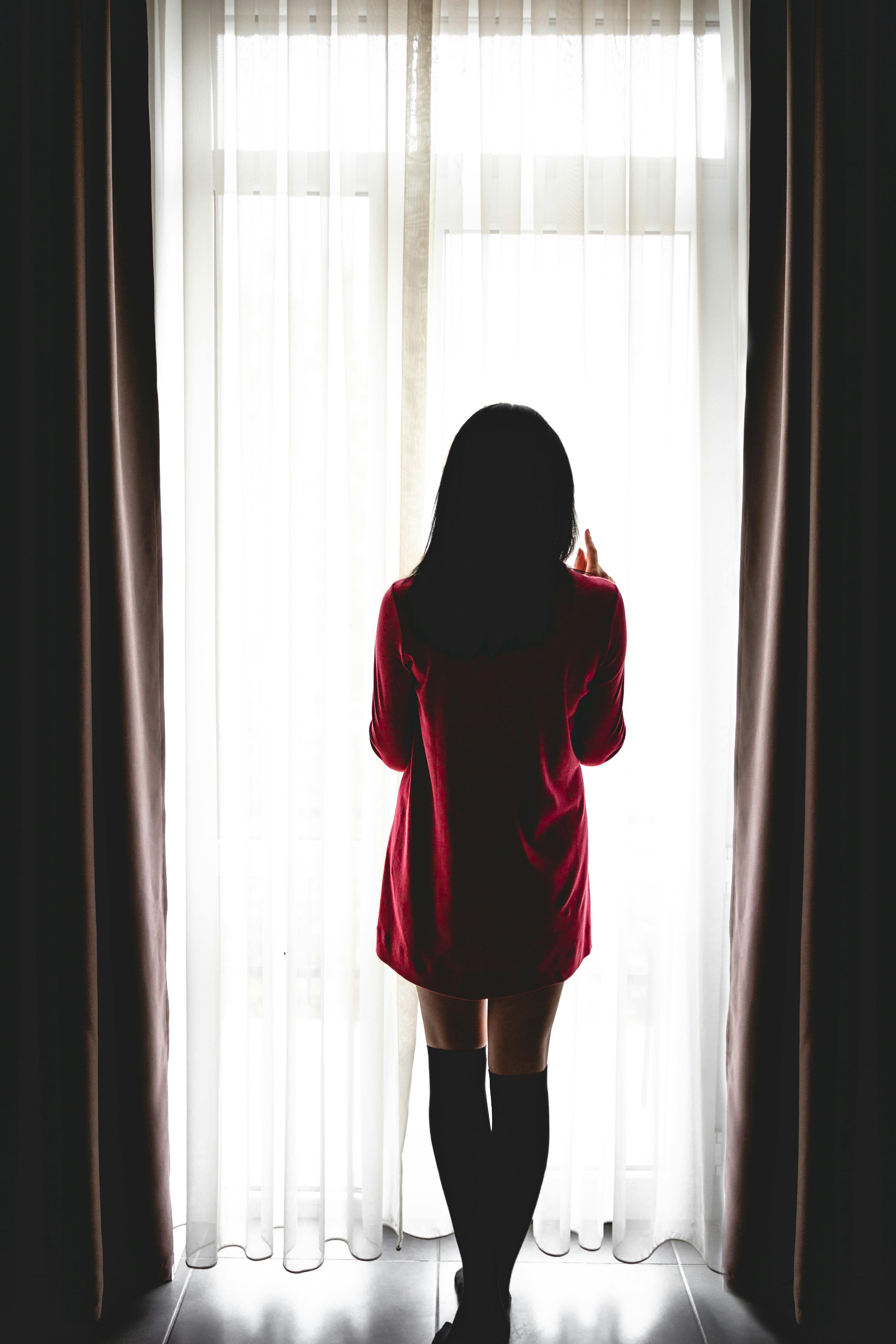 Woman Standing Near Window · Free Stock Photo