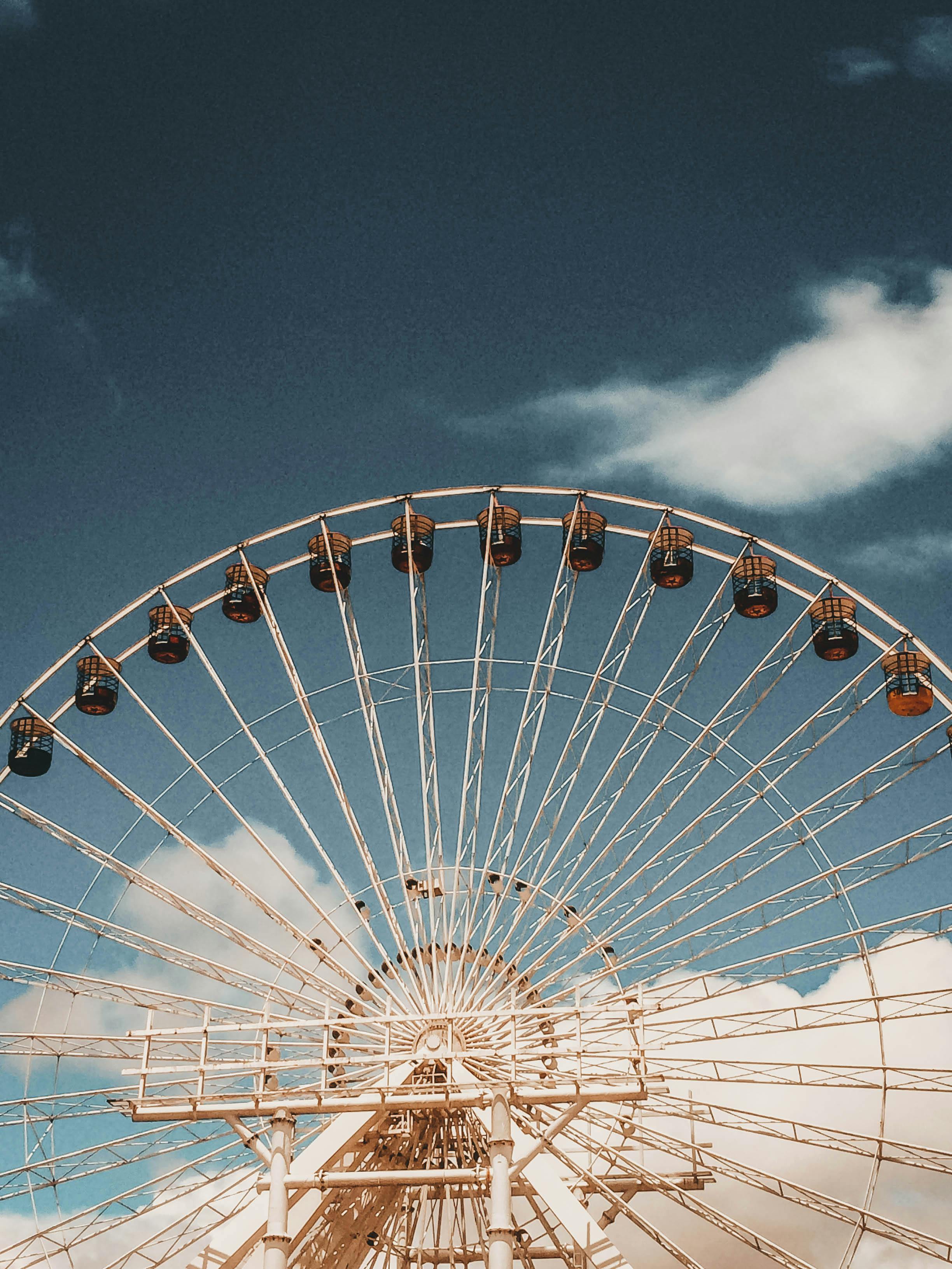 Blue Ferris Wheel Under Cloudy Sky · Free Stock Photo
