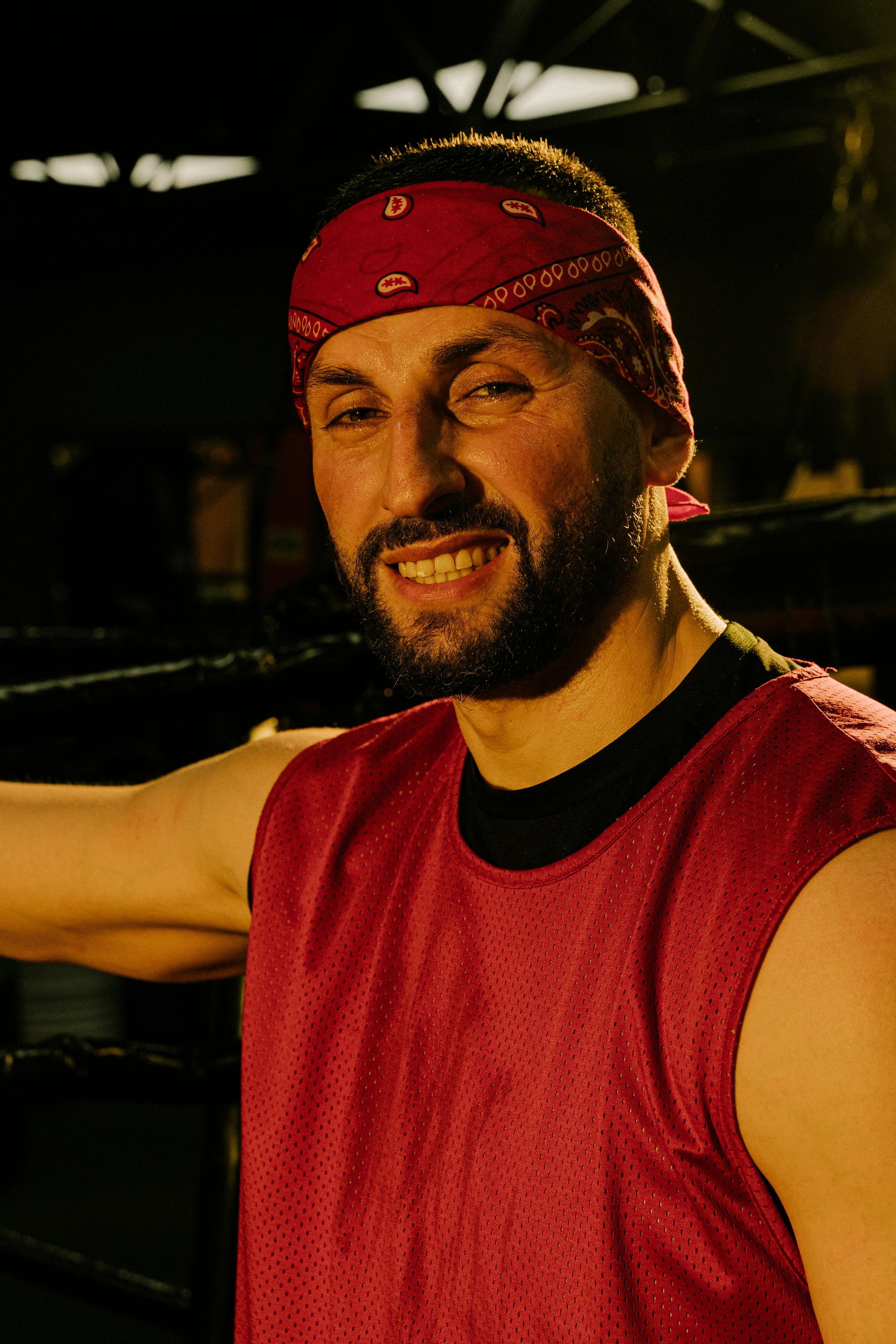 A Man in Red Tank Top Smiling · Free Stock Photo
