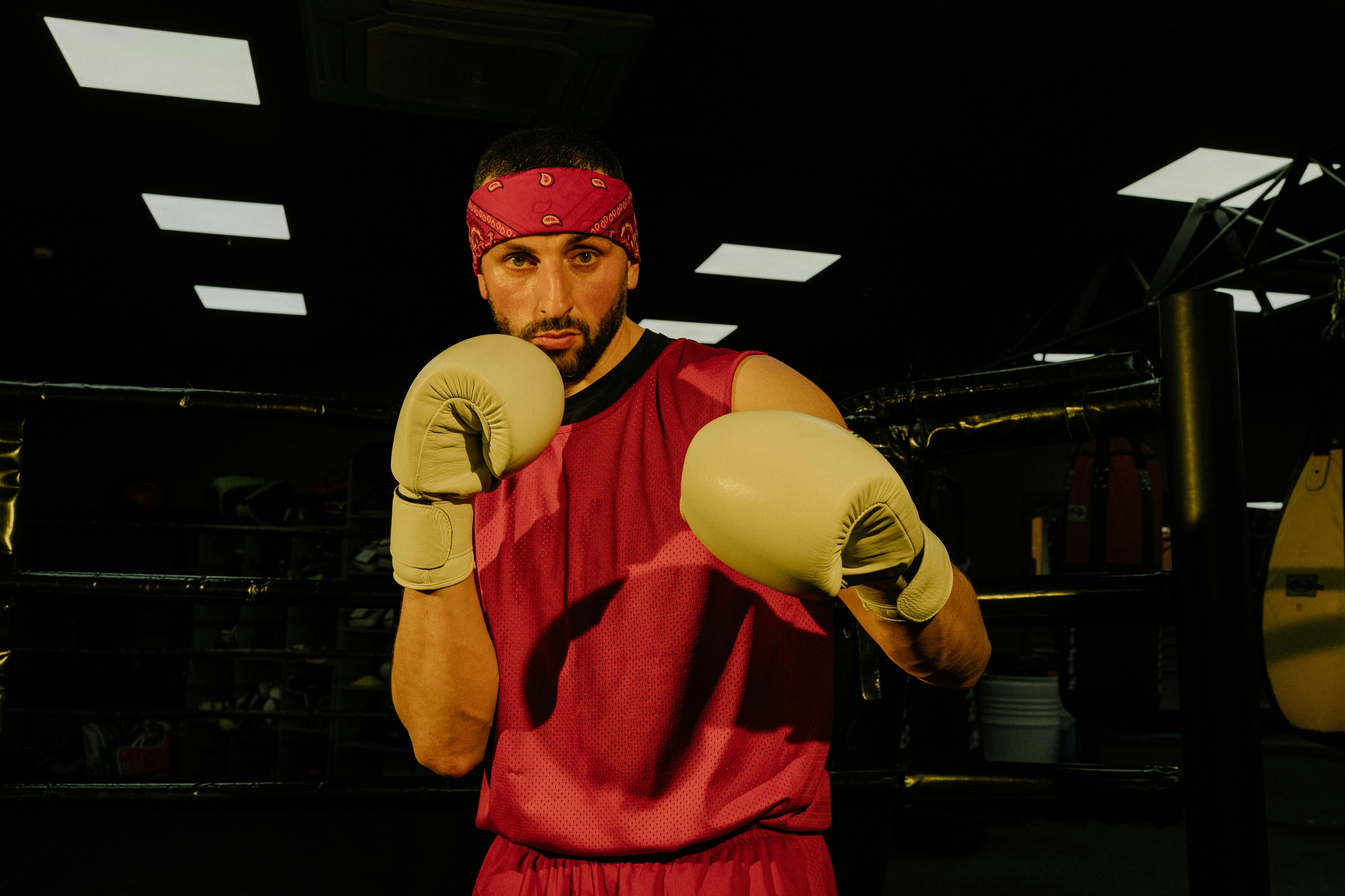 A Boxer Posing Wearing a Boxing Gloves · Free Stock Photo