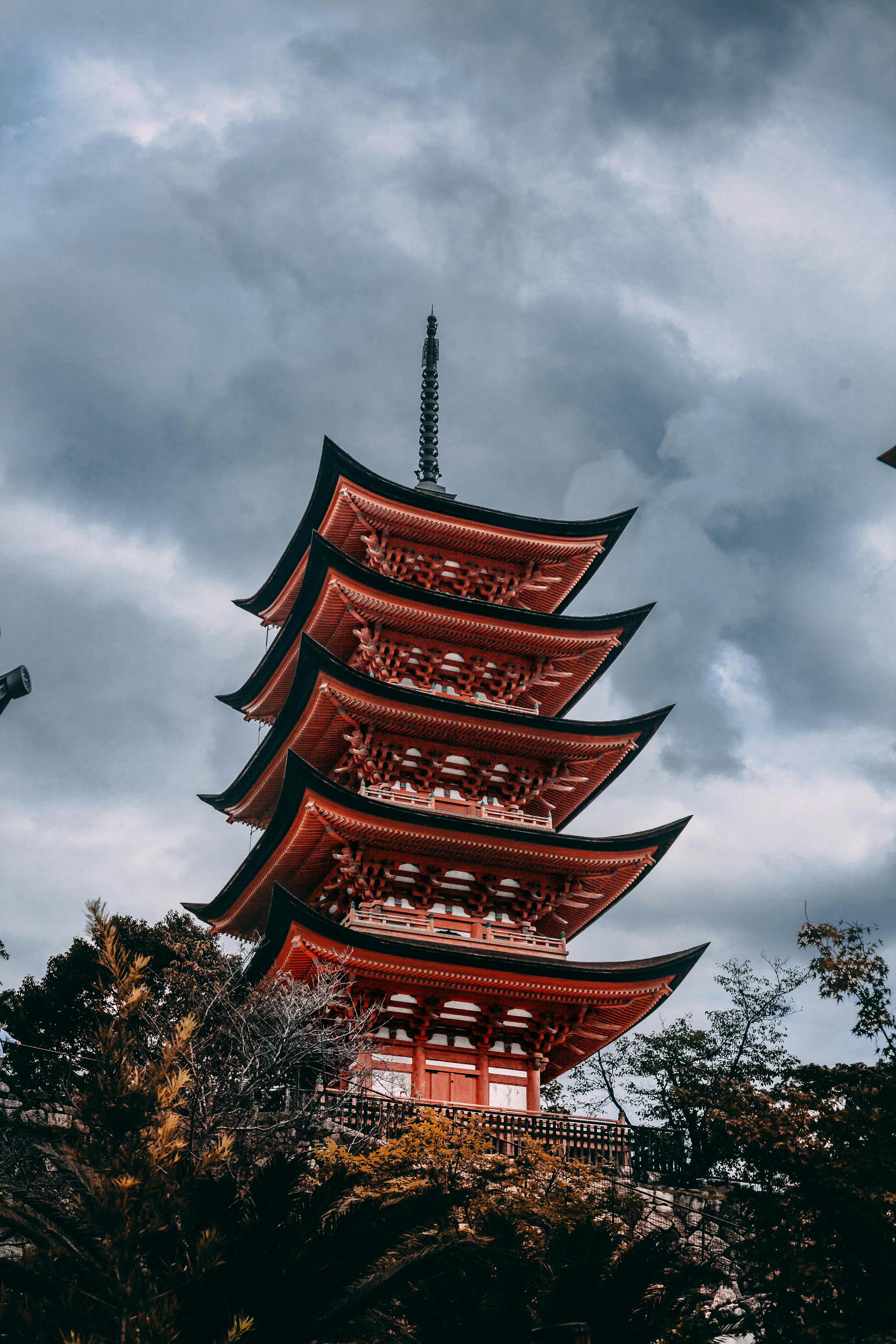 Red and Black Temple Under Gray Cloudy Sky · Free Stock Photo