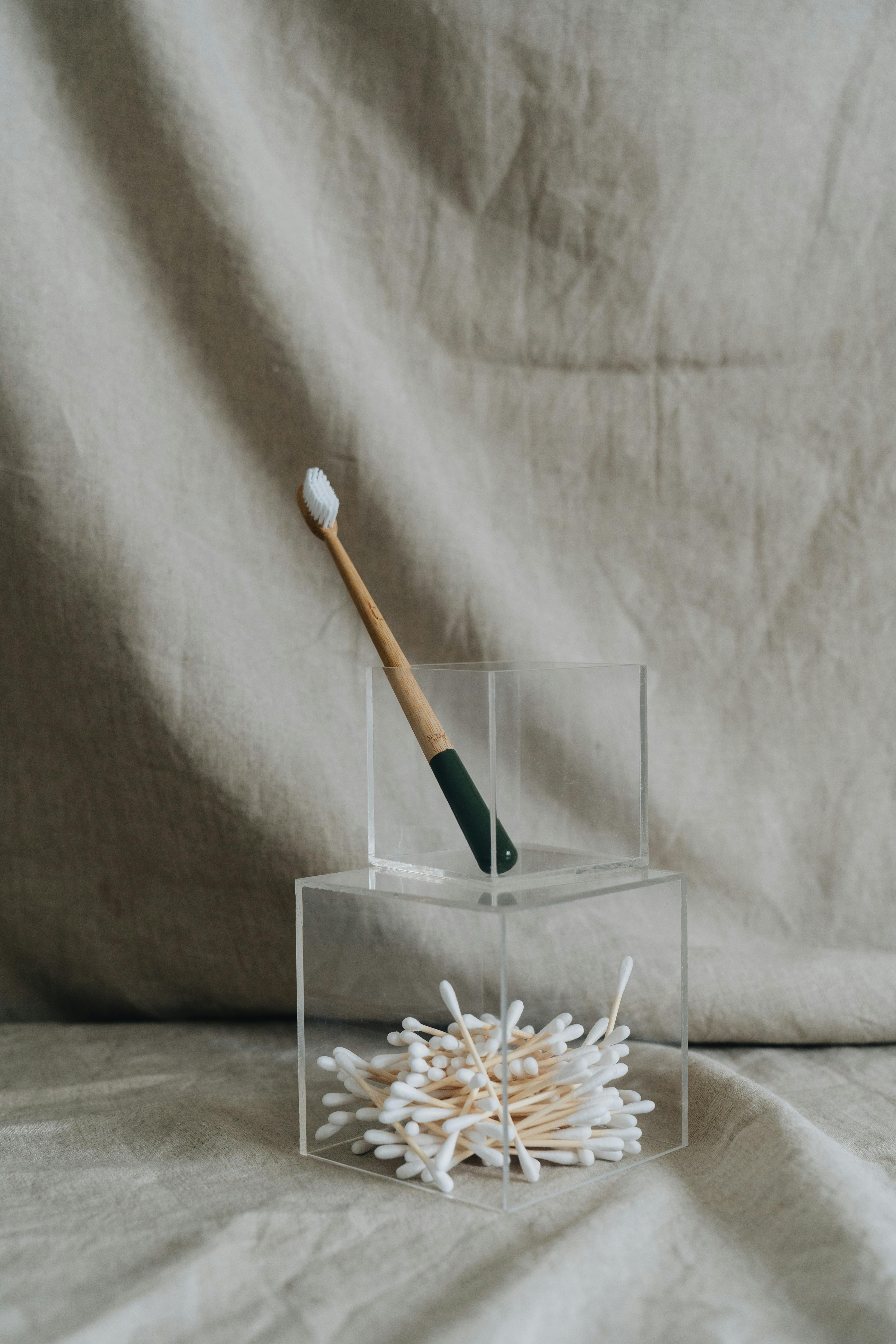 Photo Of Cotton Buds And Toothbrush · Free Stock Photo