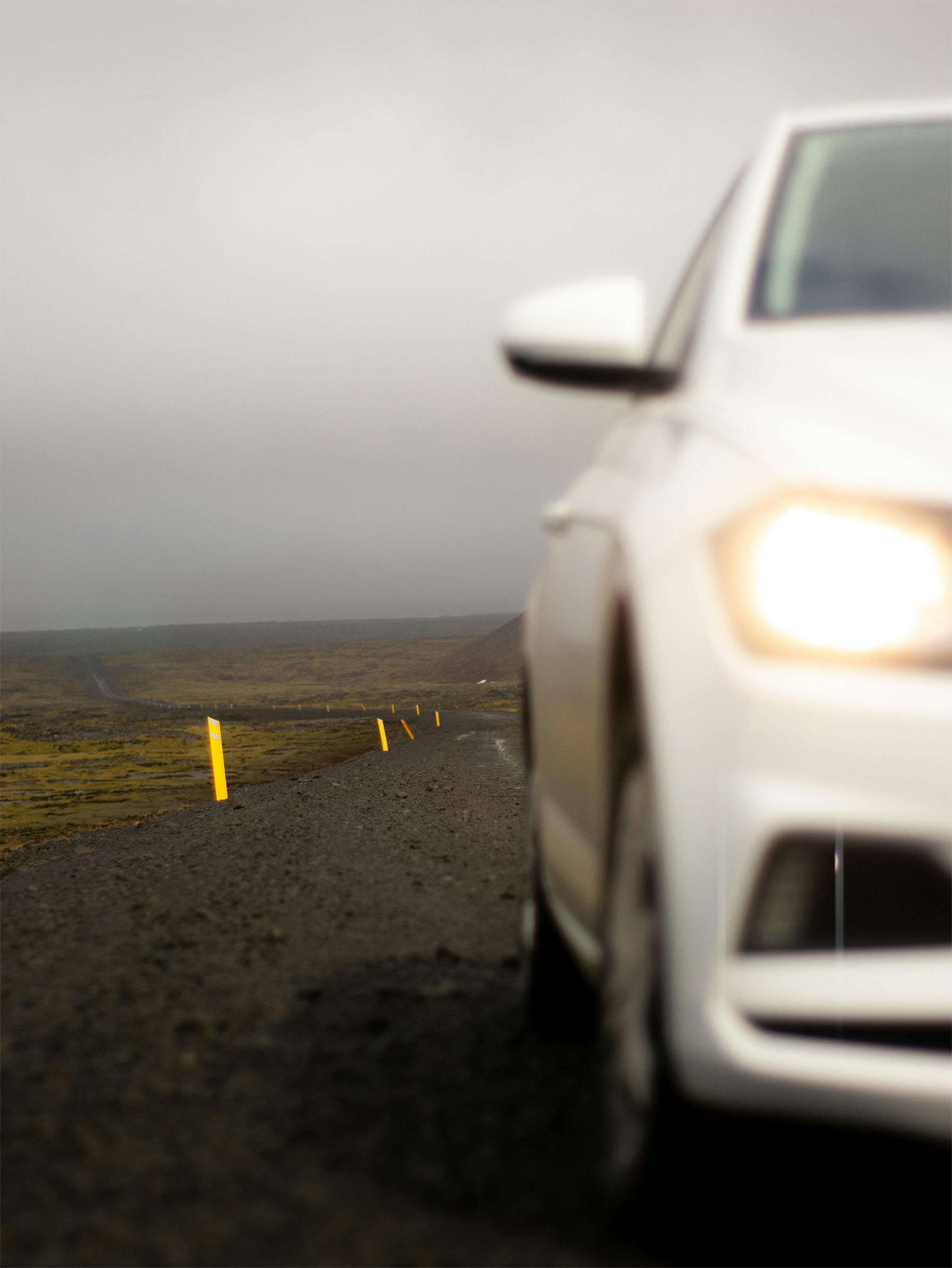 Person Taking a Self Portrait on a Rear View Mirror · Free Stock Photo