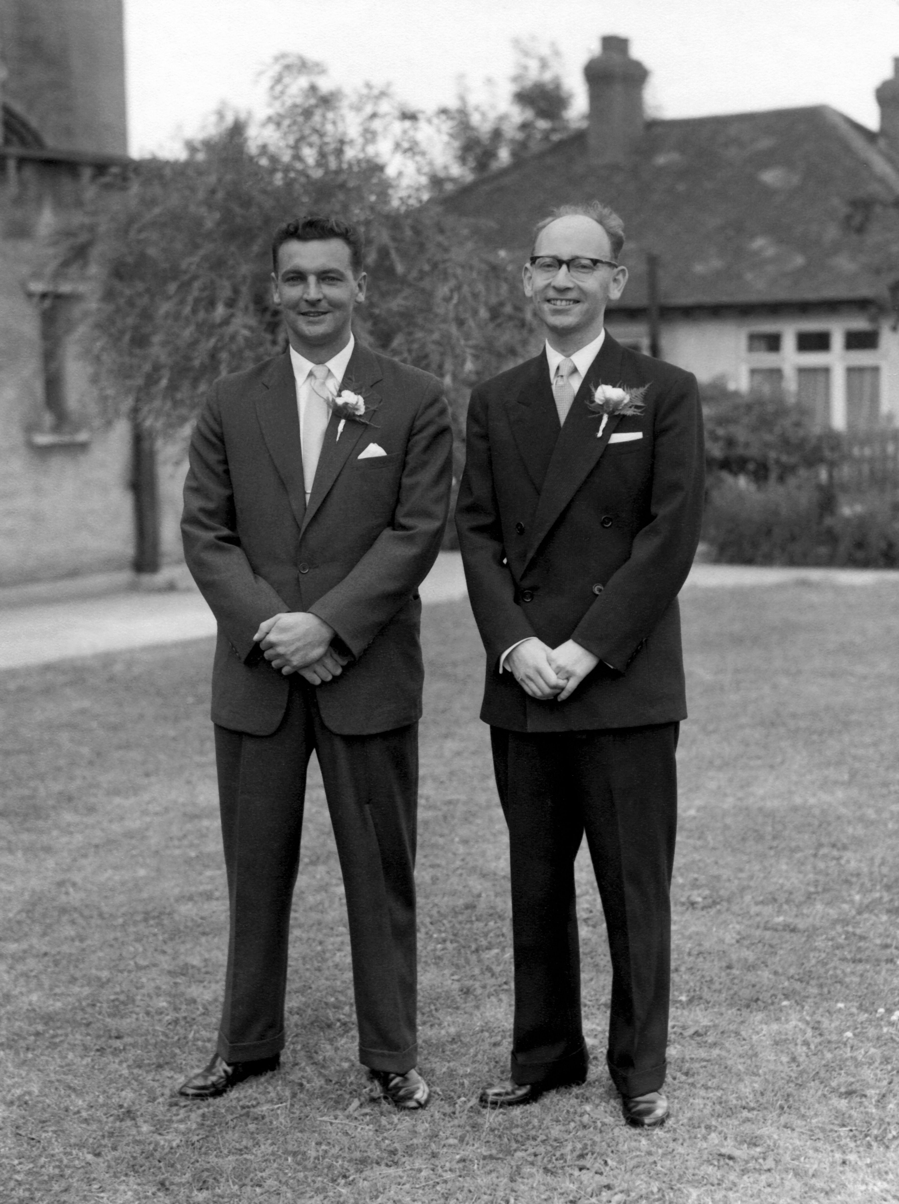 Two Men in Black Suit Standing on Grass and Smiling · Free Stock Photo