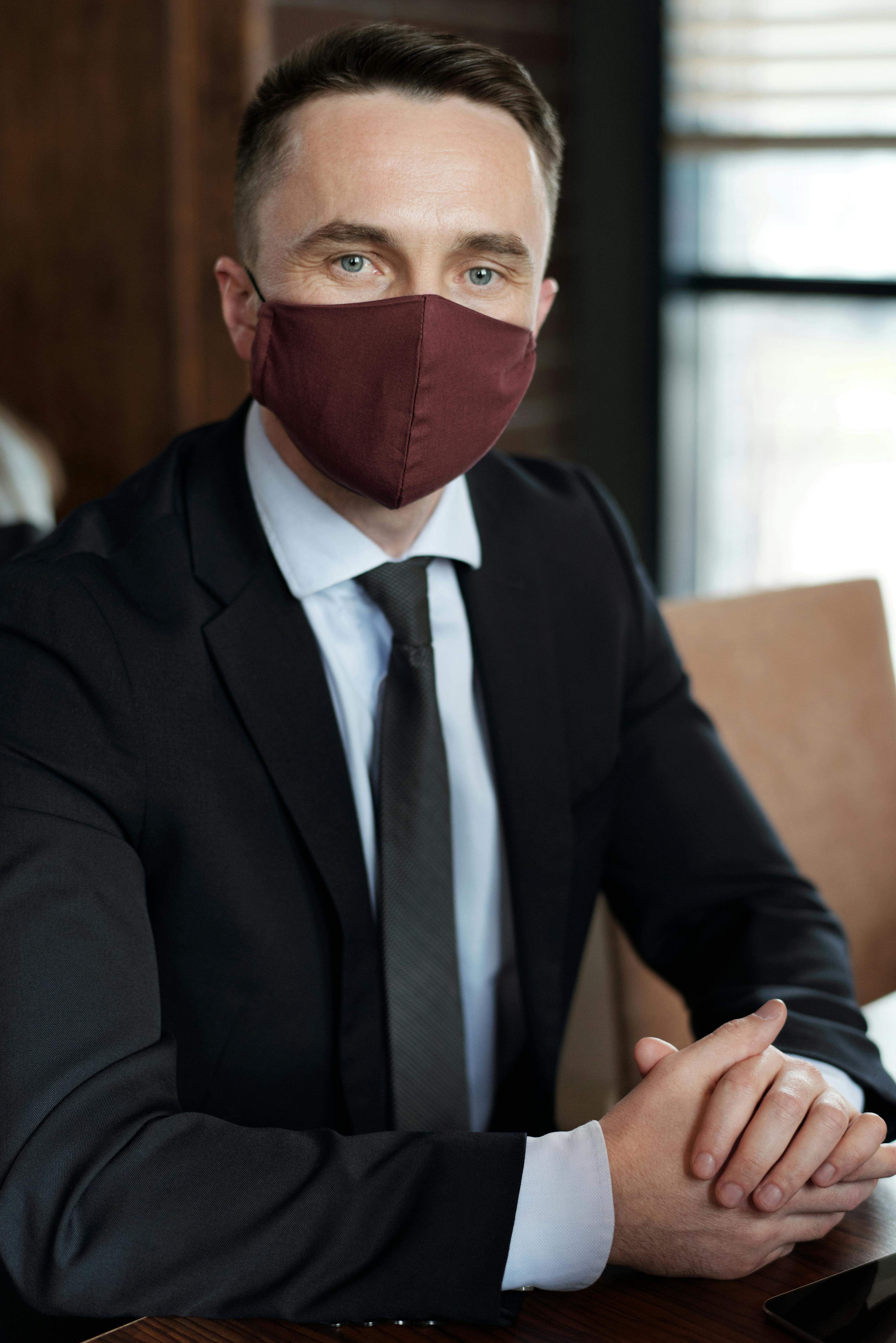 Man in Black Suit Jacket Wearing Maroon Face Mask · Free Stock Photo