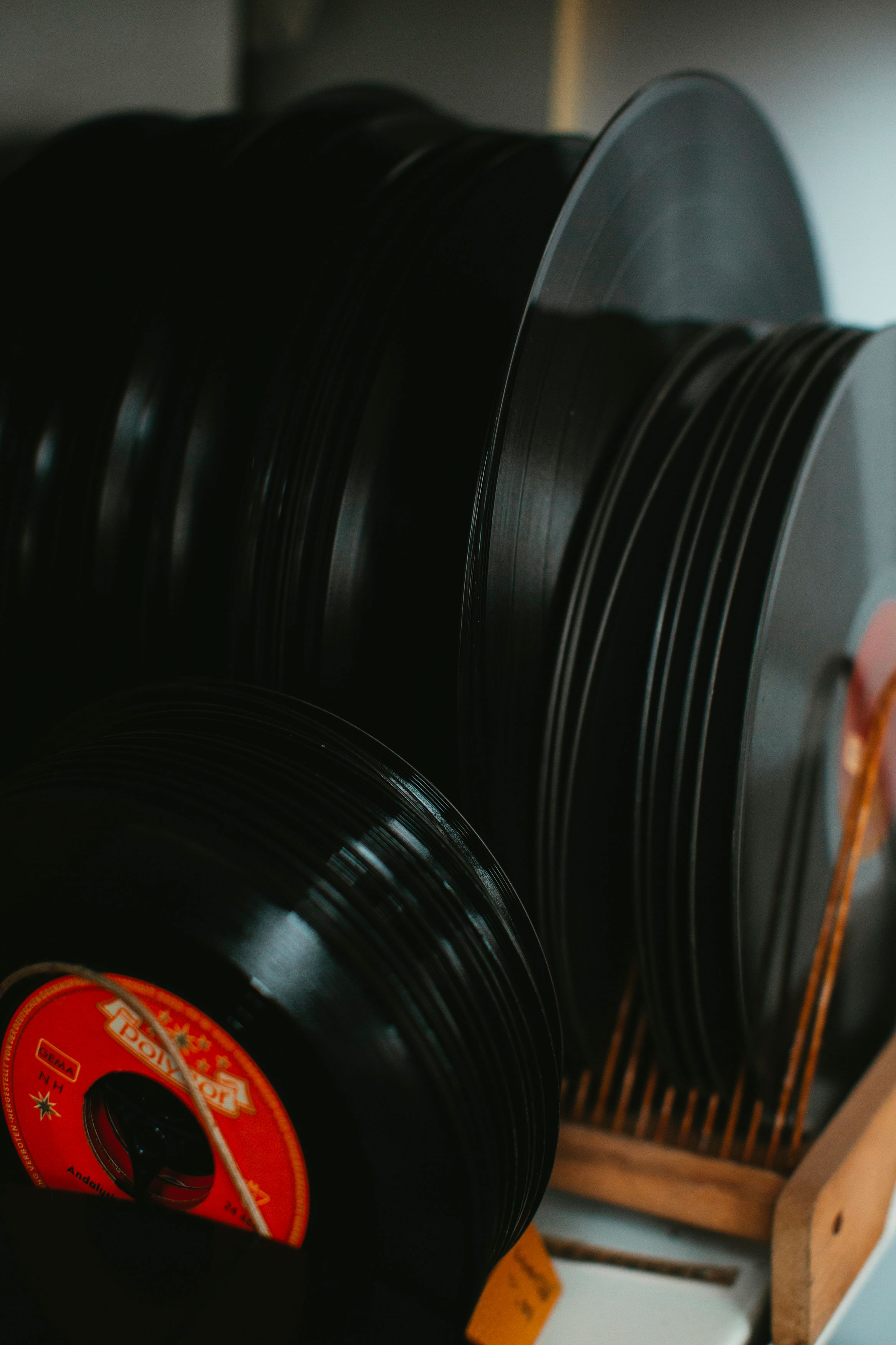 A Close-up Shot of Vinyl Records on a Rack · Free Stock Photo