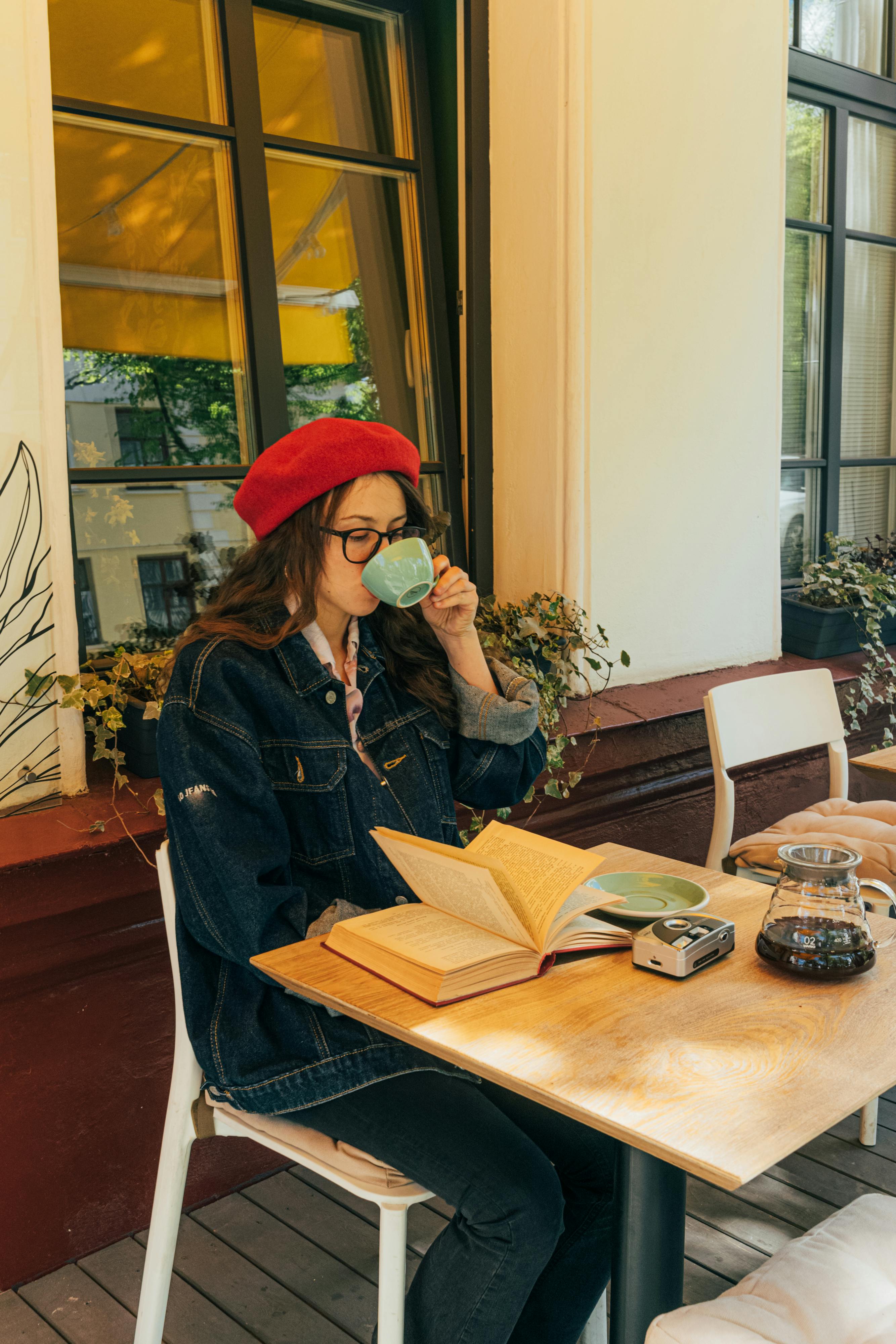 A Woman Sitting at the Table · Free Stock Photo