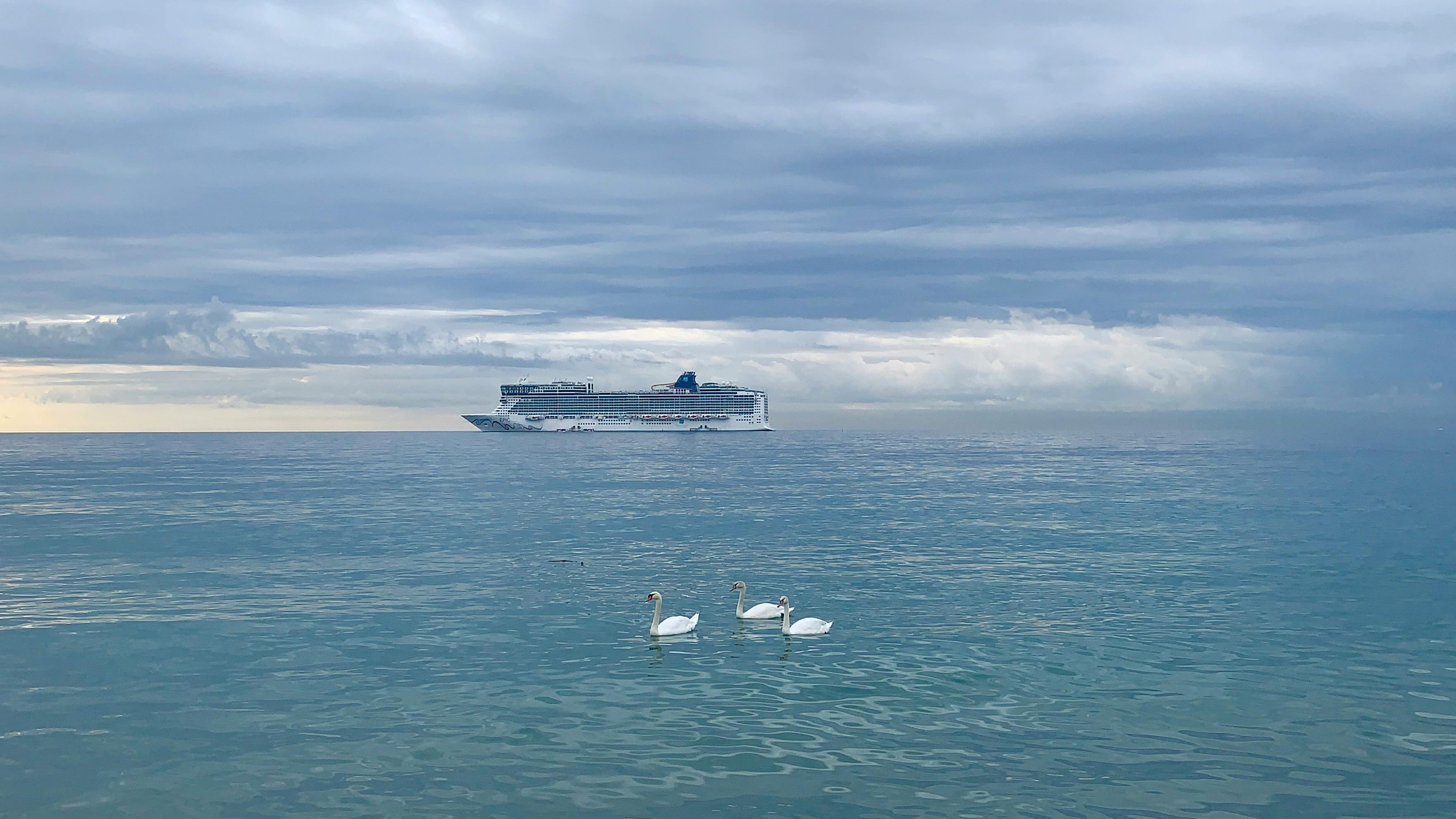 Ship floating in sea against cloudy sky · Free Stock Photo