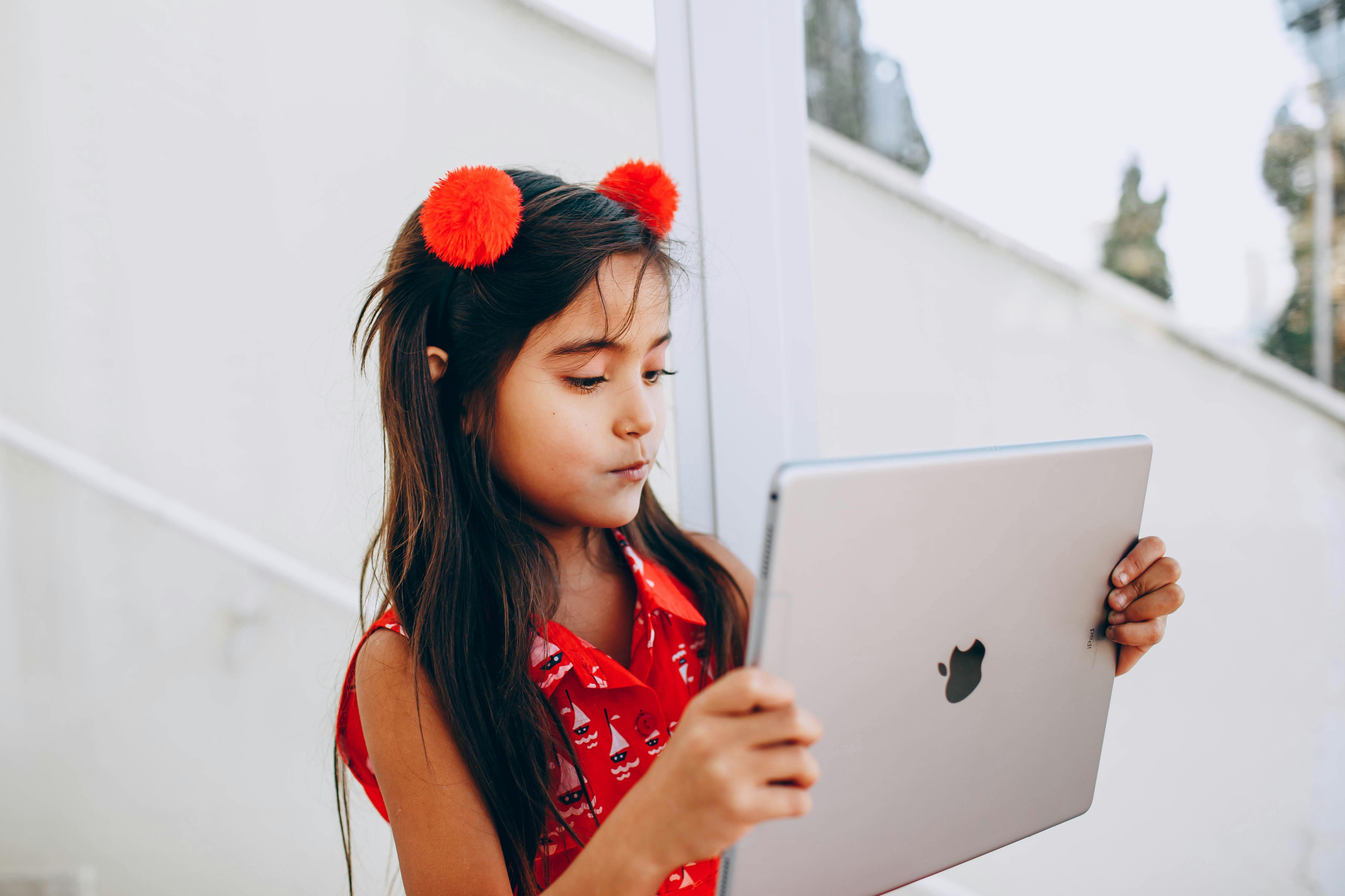 Girl in Red Dress Holding Silver Ipad Pro · Free Stock Photo