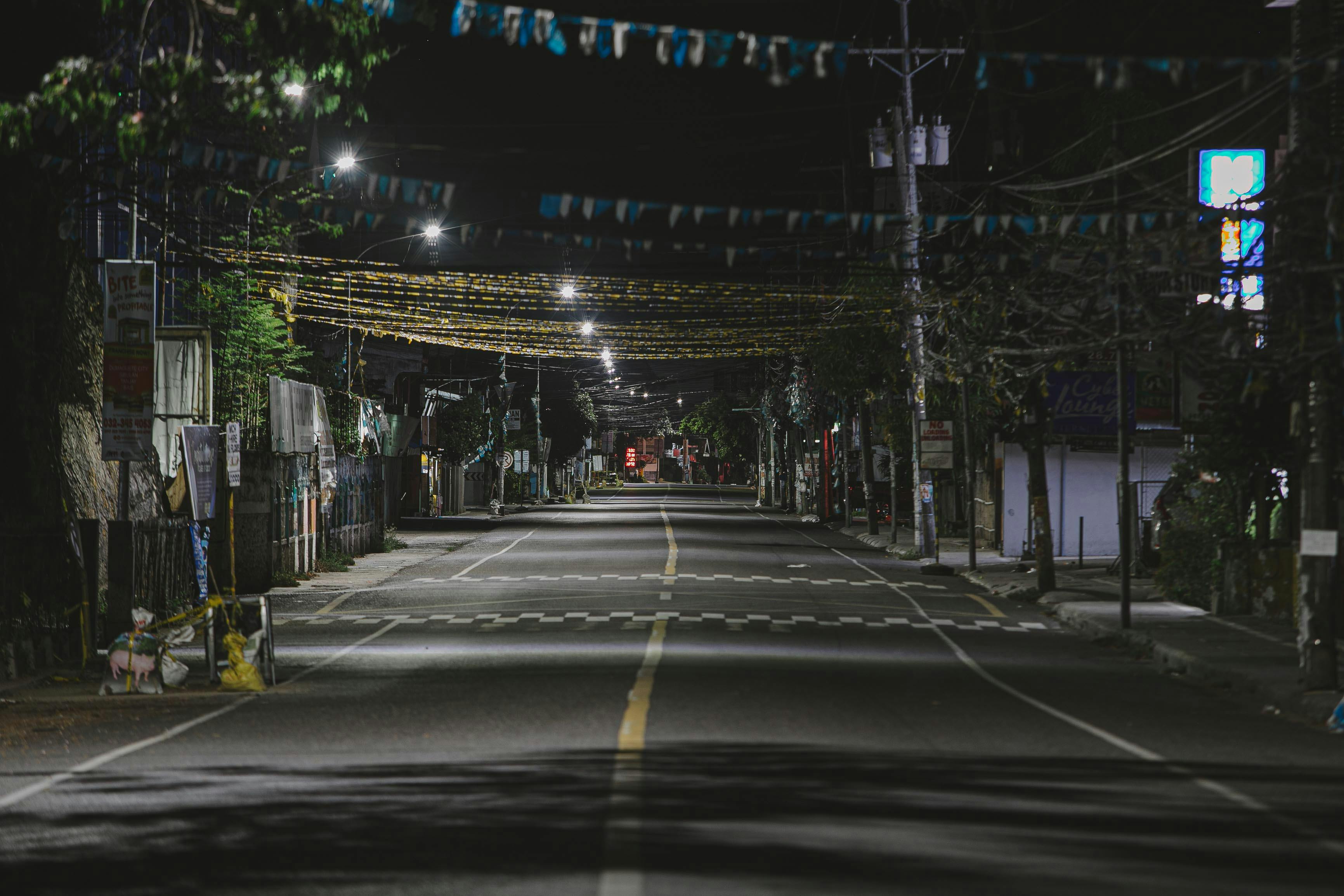 Modern glass bus stop illuminated with light at night · Free Stock Photo