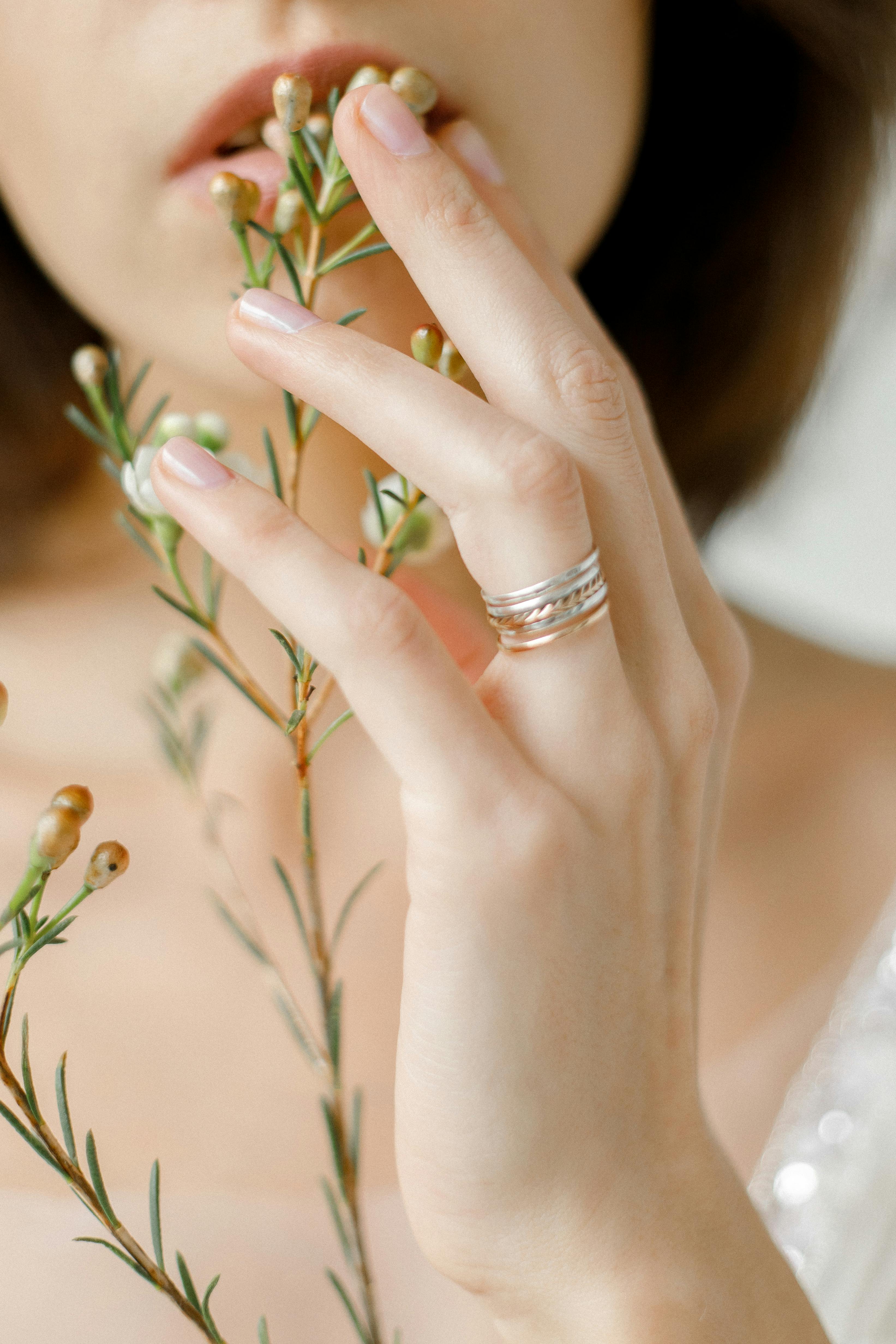 A Hand Wearing a Plastic Diamond Ring with Chains · Free Stock Photo